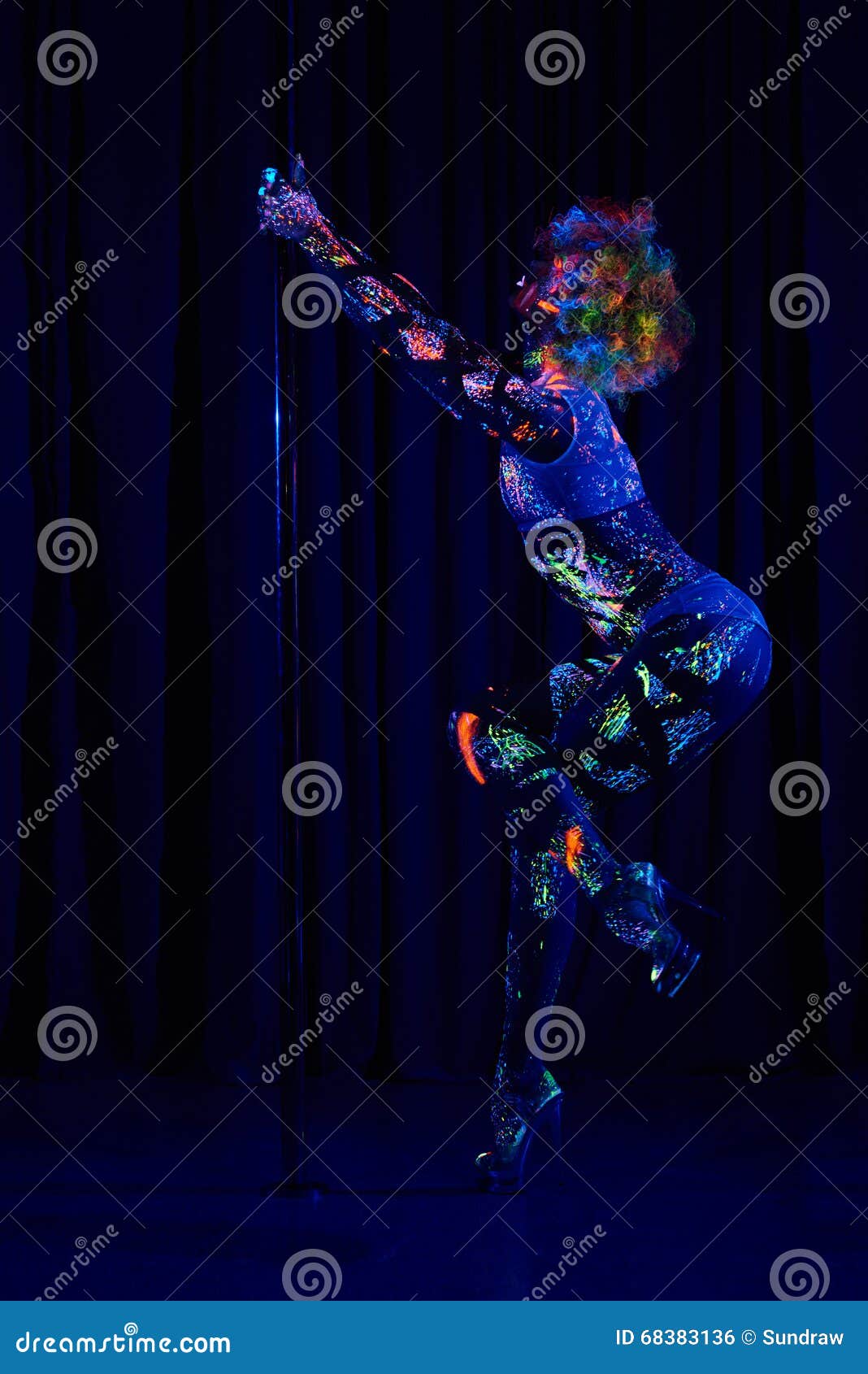 Female Pole Dancer in Bright Neon Colours Under Ultraviolet Stock Photo ...