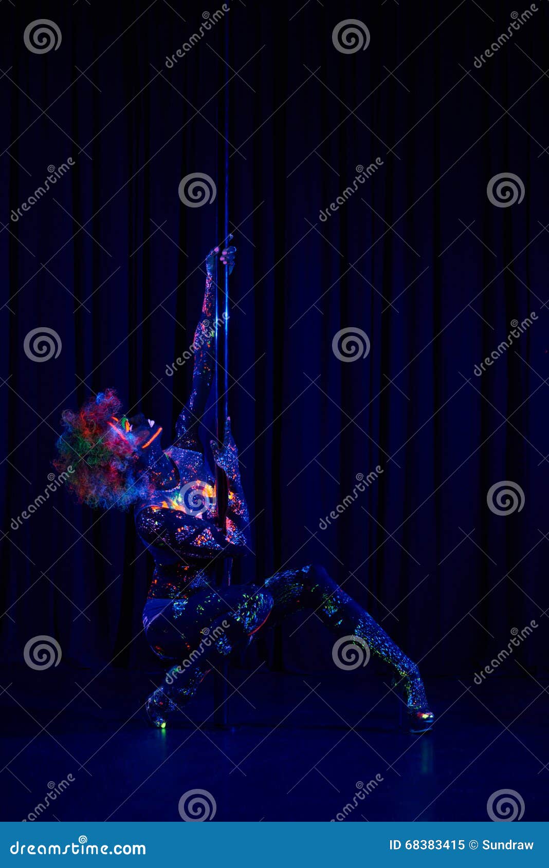 Female Pole Dancer in Bright Neon Colours Under Ultraviolet Stock Image ...