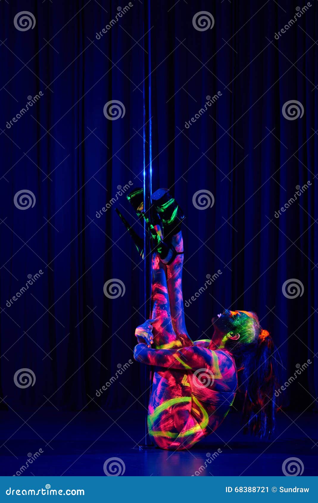 Female Pole Dancer in Bright Neon Colours Under Ultraviolet Stock Image ...