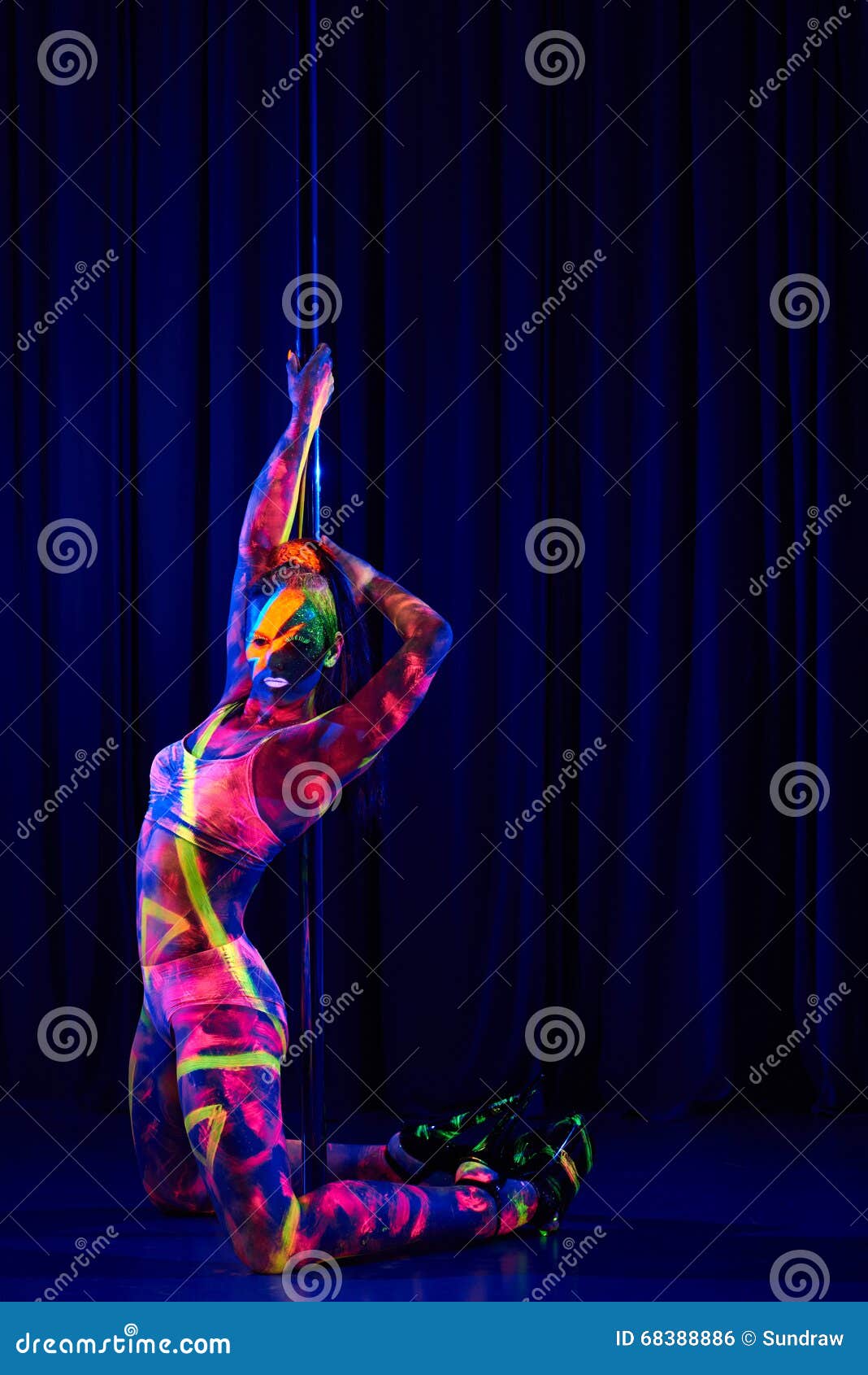 Female Pole Dancer in Bright Neon Colours Under Ultraviolet Stock Photo ...