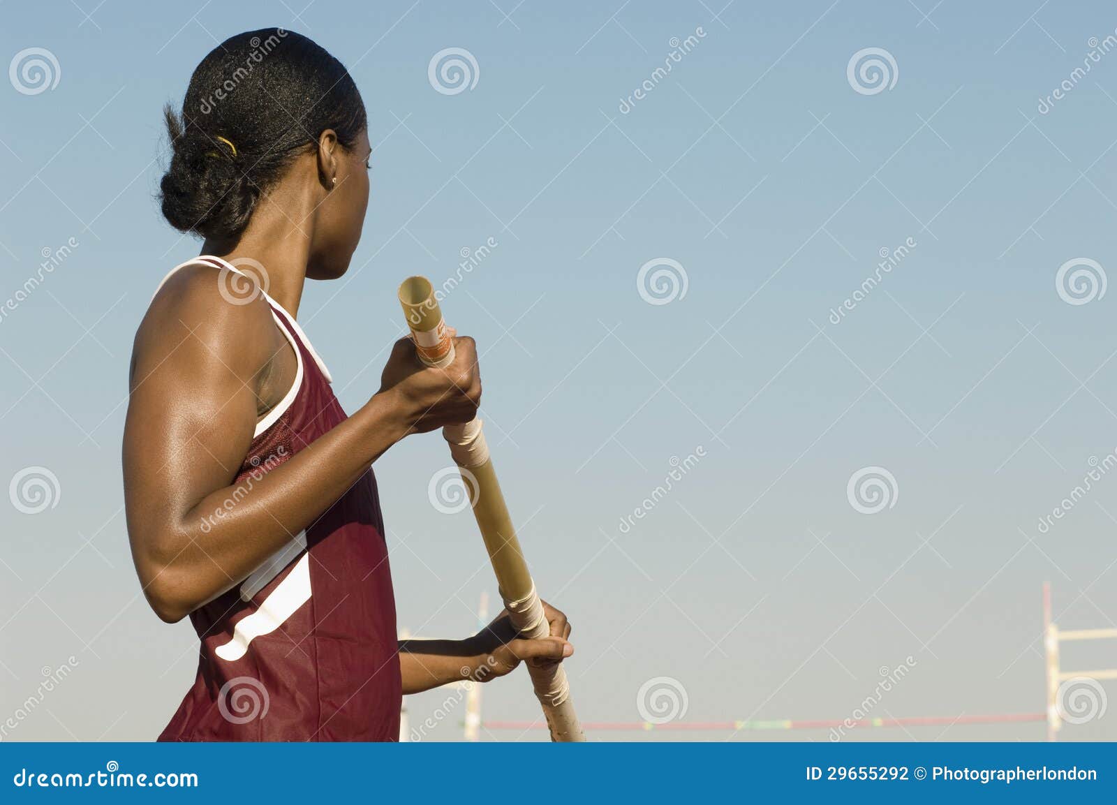 Female Pole Dancer Doing Exercises In Lateral Position On The Pole ...