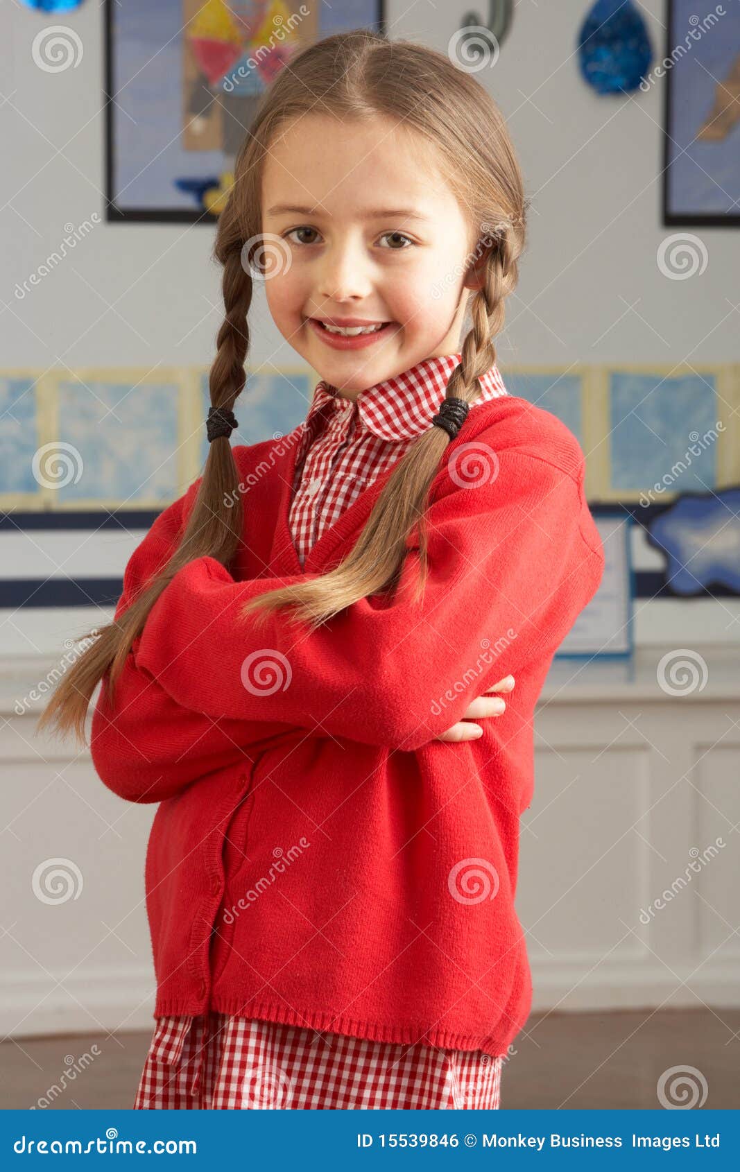 Female Primary School Pupil Standing Stock Photo - Image of smiling ...