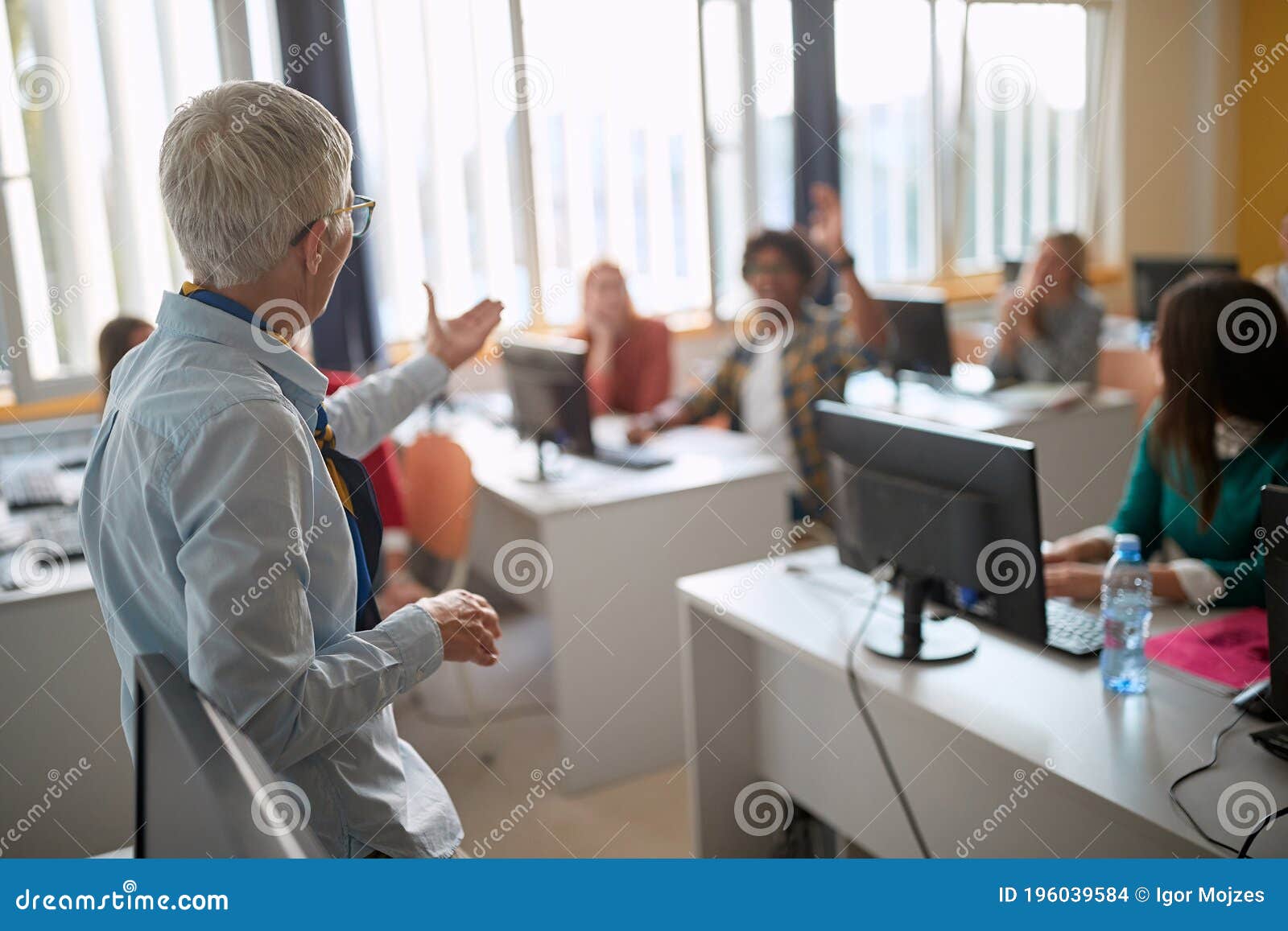 Female Professor Answering Student`s Question at an Informatics Lecture ...