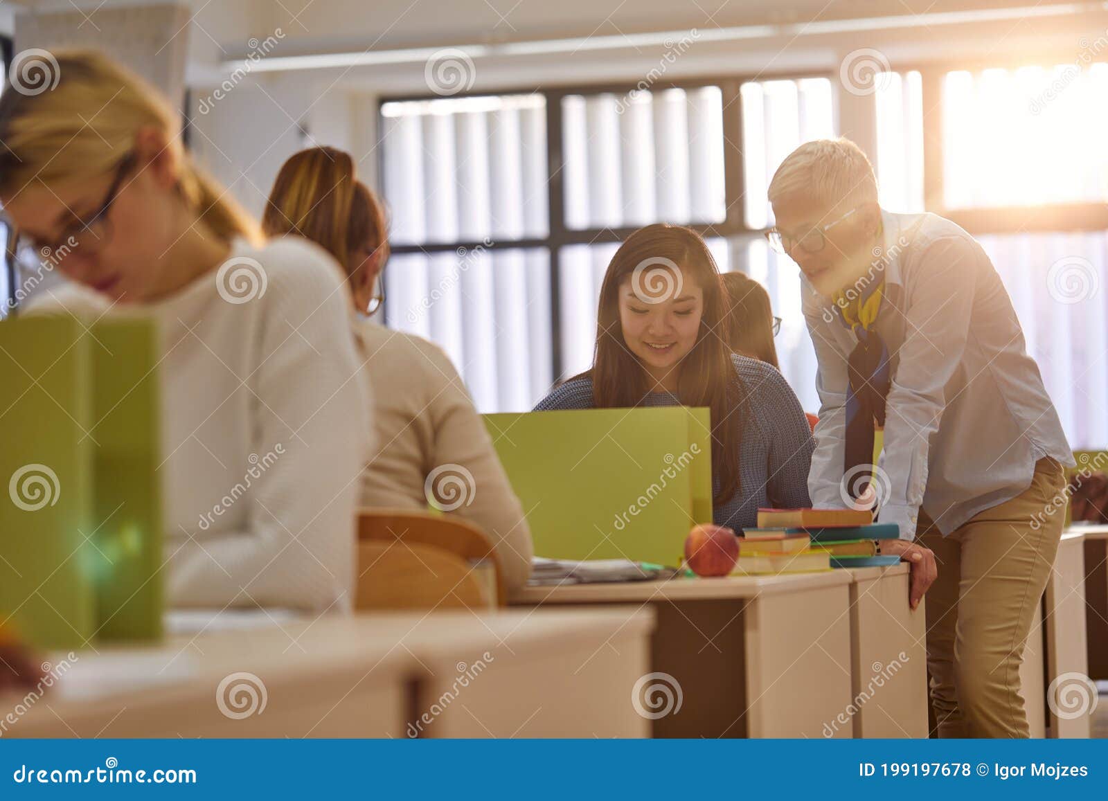 Female Professor Correcting Students Stock Photo - Image of academy ...
