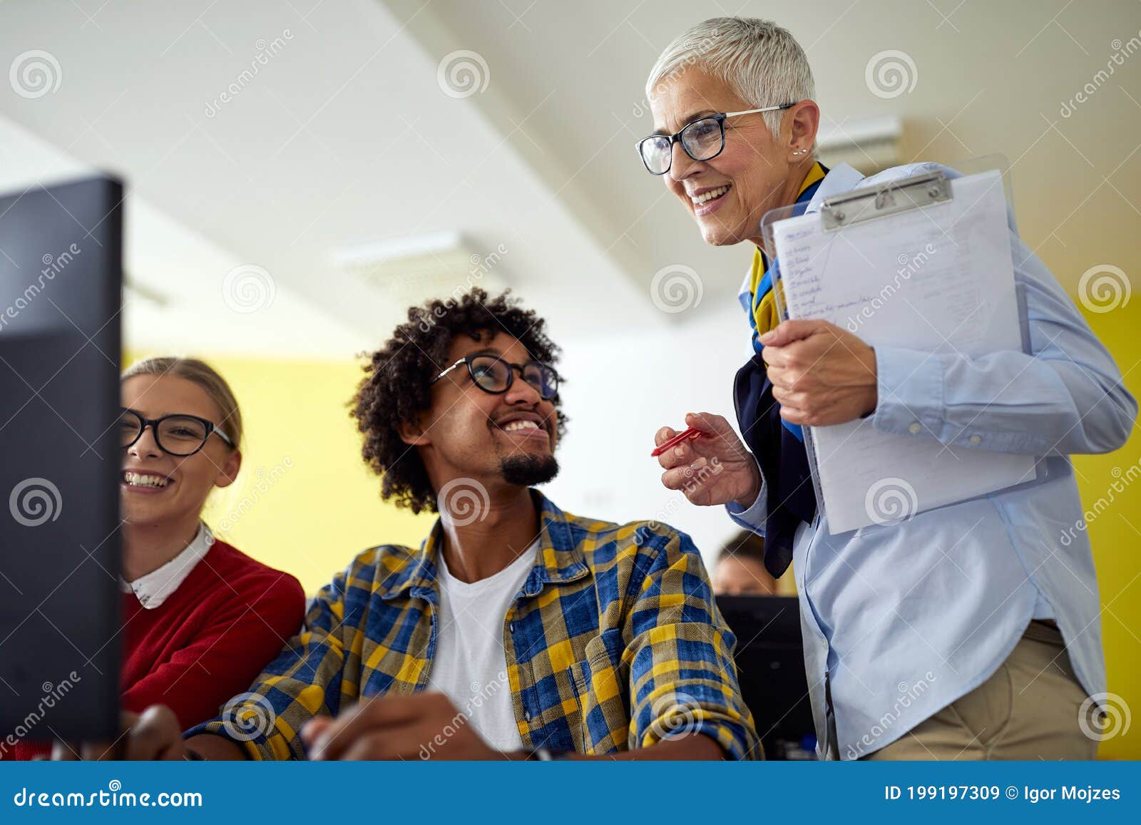 Female Professor Helping Students at the Informatics Lecture Stock ...