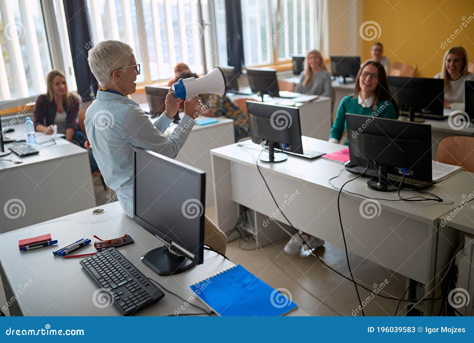 Female Professor Speaking through a Megaphone at an Informatics Lecture ...