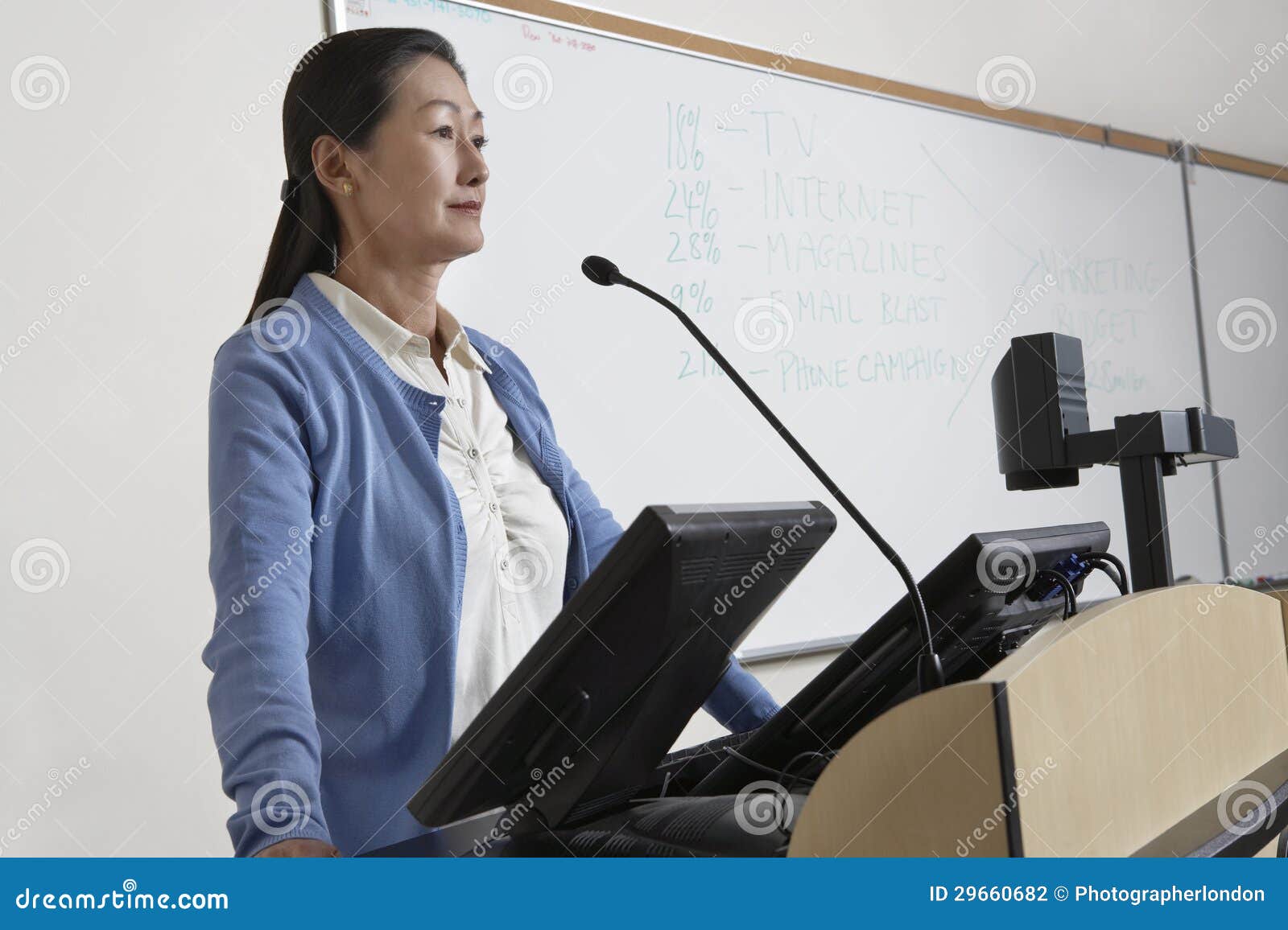 Female Professor Standing By Podium Stock Photo | CartoonDealer.com ...