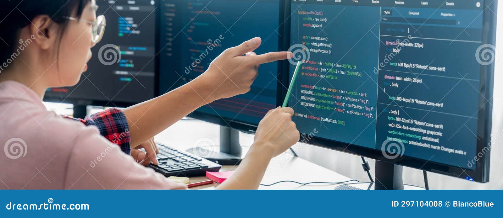Female Programer Explain While Pointing Code Displayed On Computer