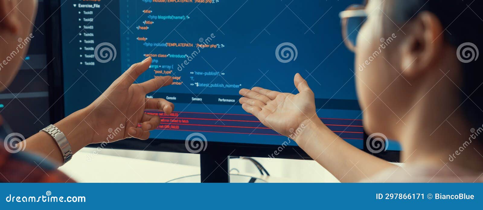 Female Programer Explain While Pointing Code Displayed On Computer