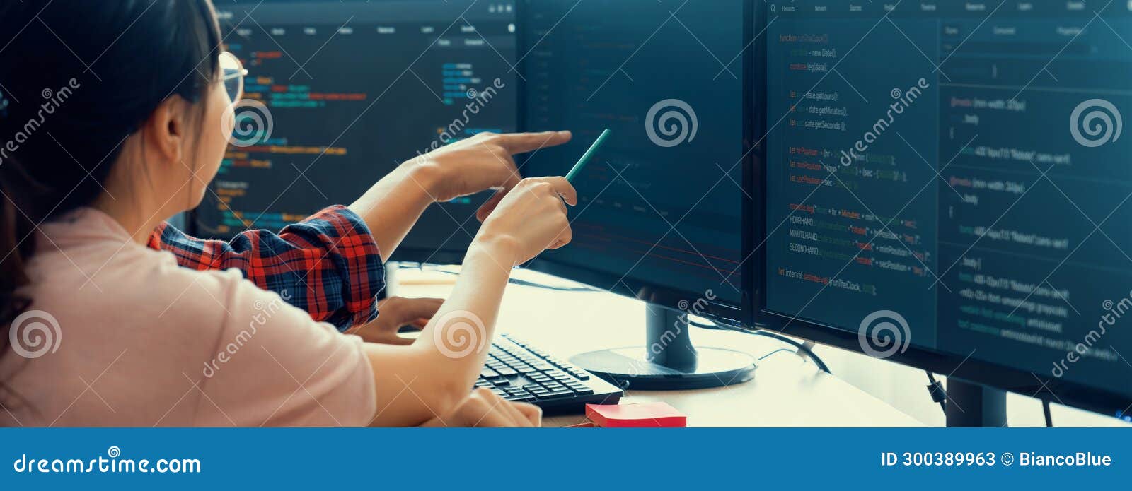 Female Programer Explain while Pointing Code Displayed on Computer. Burgeoning. Stock Image ...