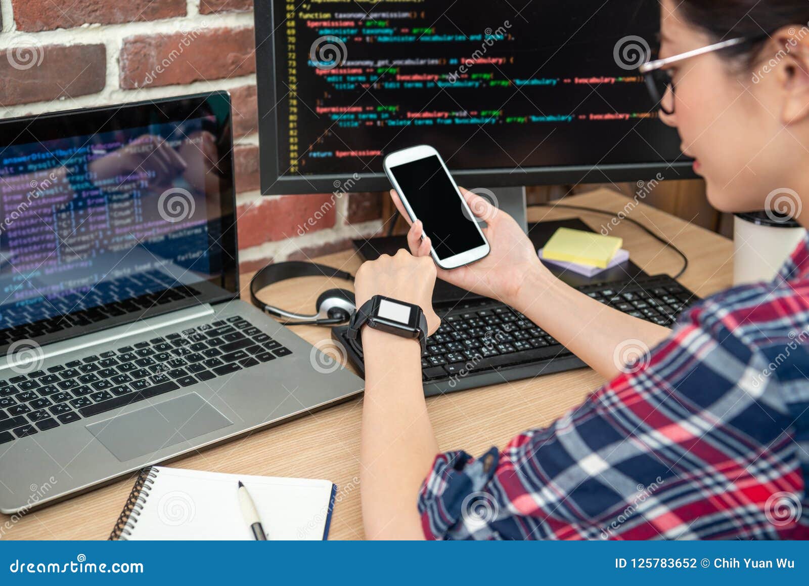 Programmer Checking Phone and Smartwatch Stock Photo - Image of closeup ...