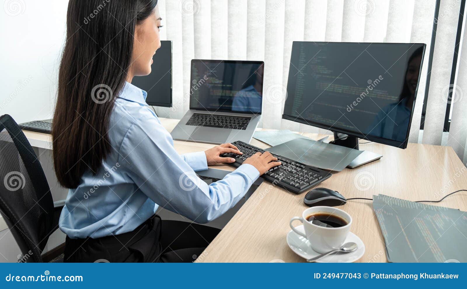 Female Programmer Using Multiple Monitor Screen To Development Business Website while Working To ...