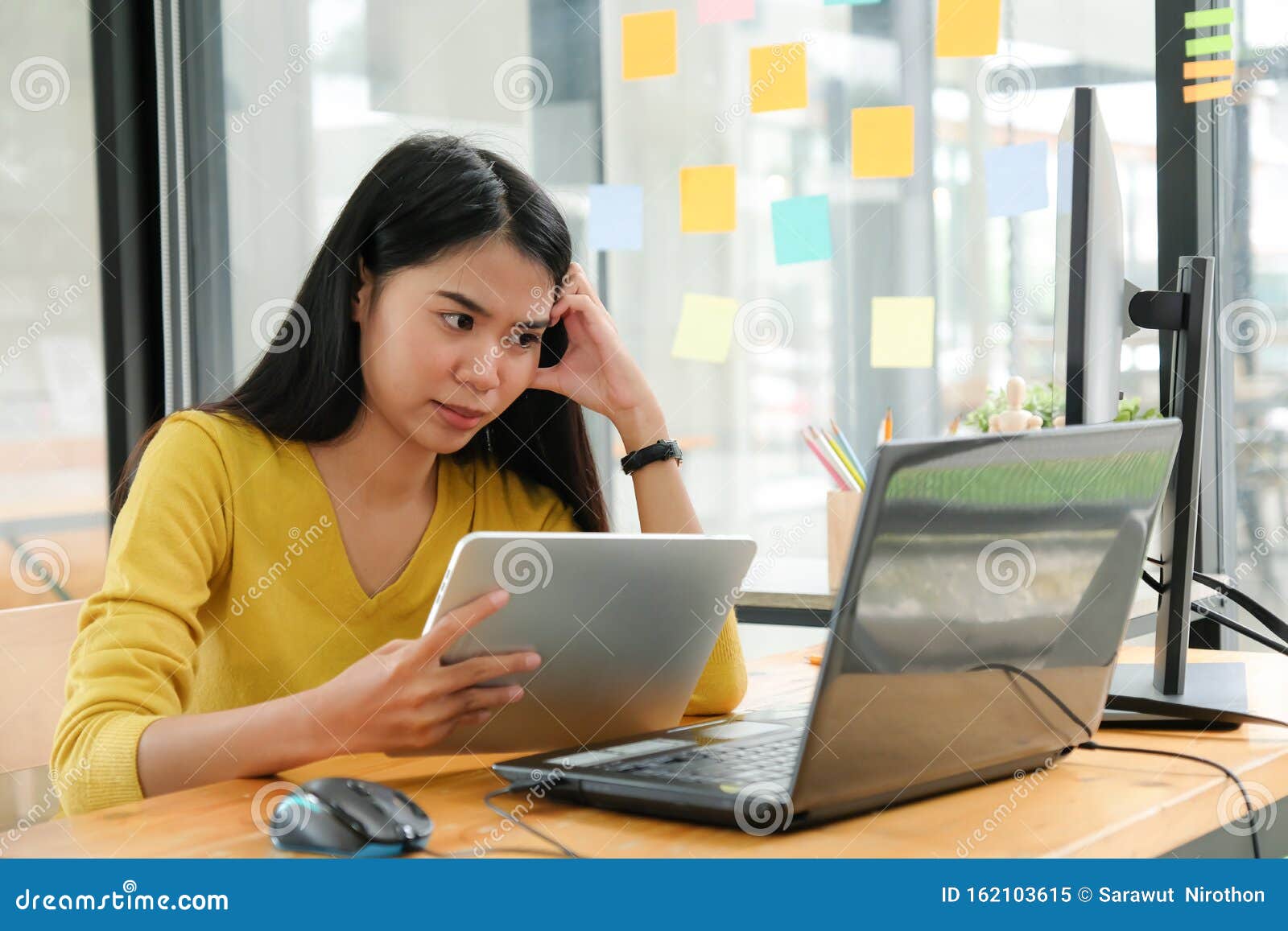 Female Programmer are Using Tablet To Create Programs for Clients. she ...