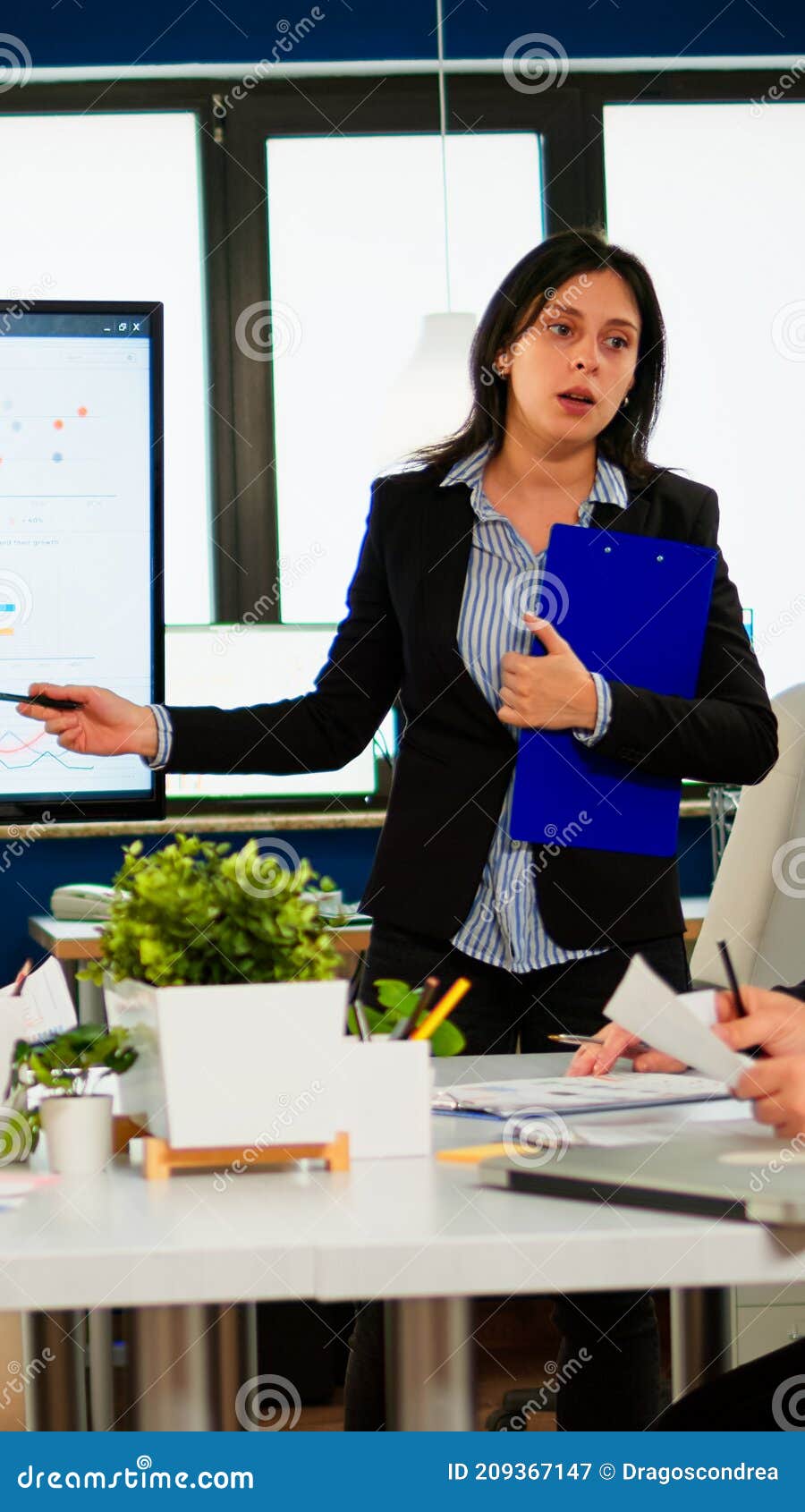 Female Project Manager Holding Financial Meeting Showing Statistical ...