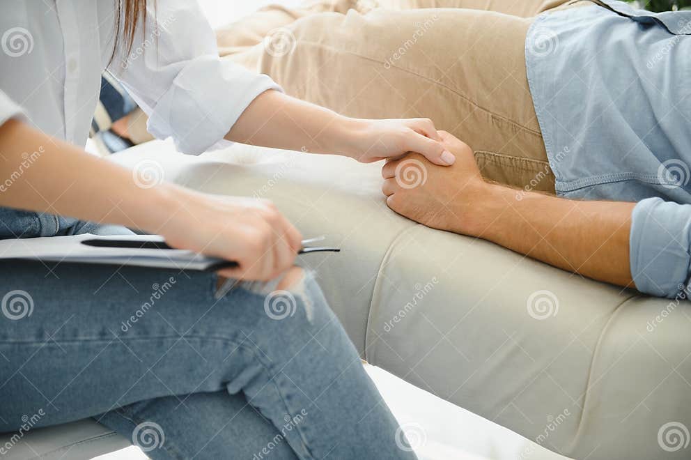 Female Psychologist Conducts Psychotherapy Session For Man Patient In