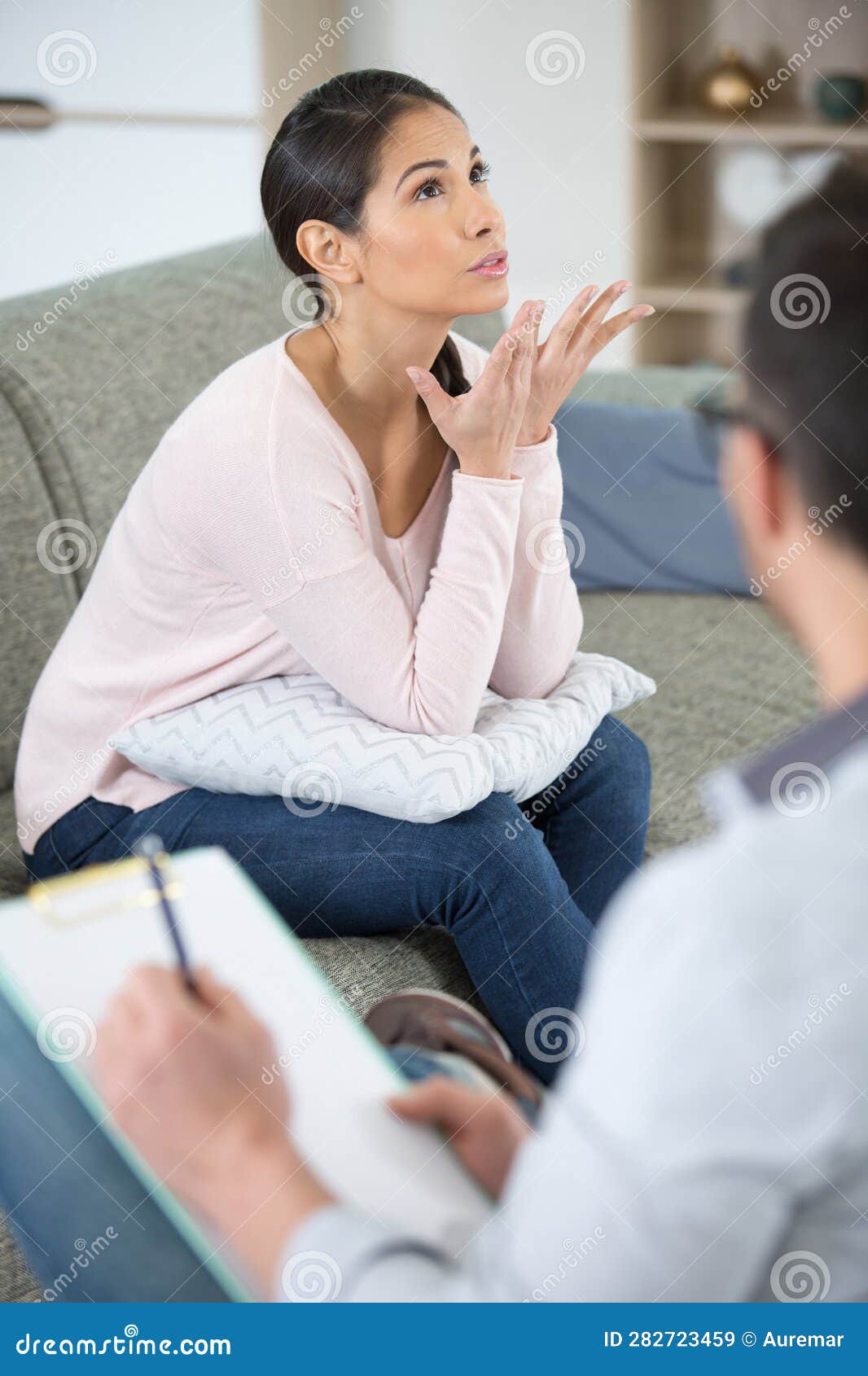 Female Psychologyst Therapy Session with Client Indoors Sitting Taking ...