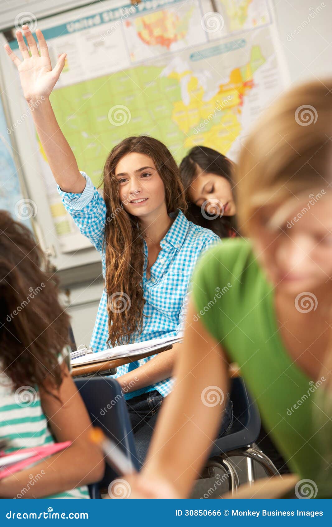 Female Pupil Answering Question in Classroom Stock Photo - Image of ...