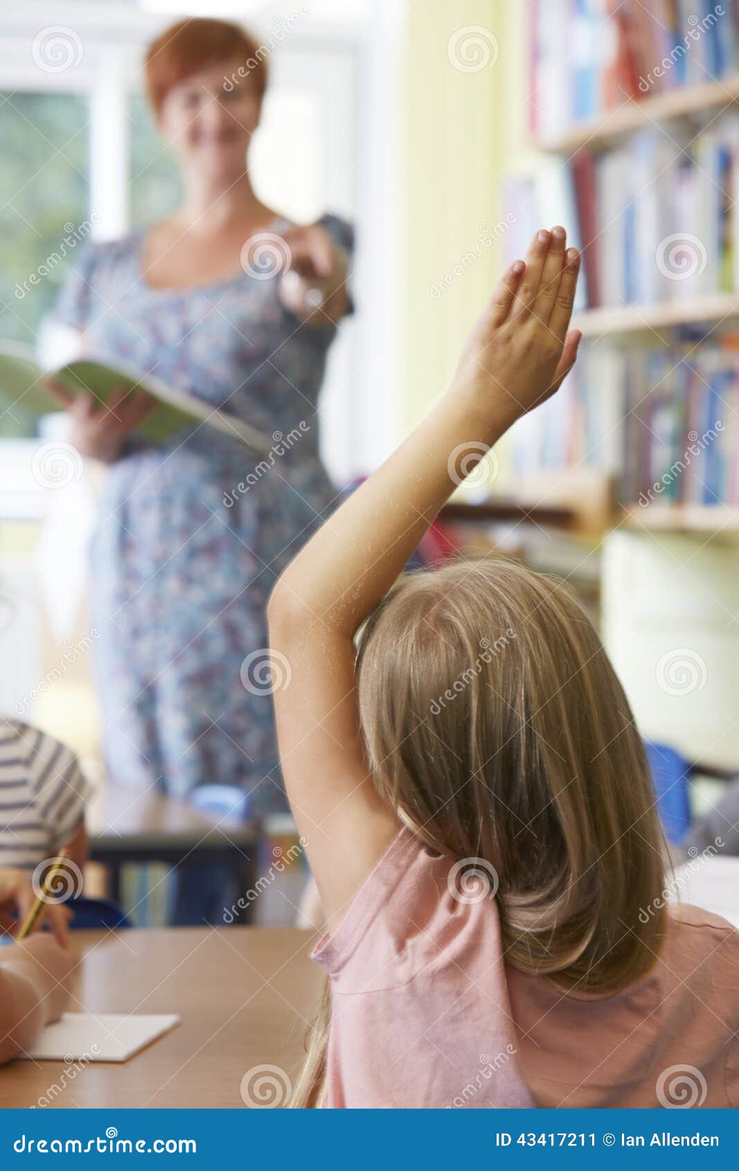 Female Pupil Answering Question in School Classroom Stock Image - Image ...
