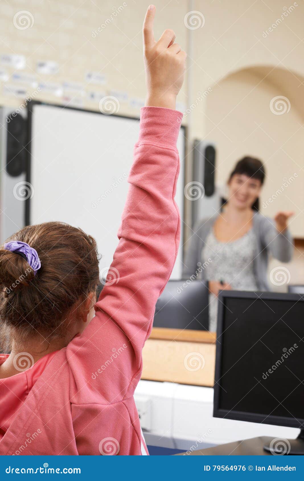 Female Pupil Answering Question in School Classroom Stock Photo - Image ...