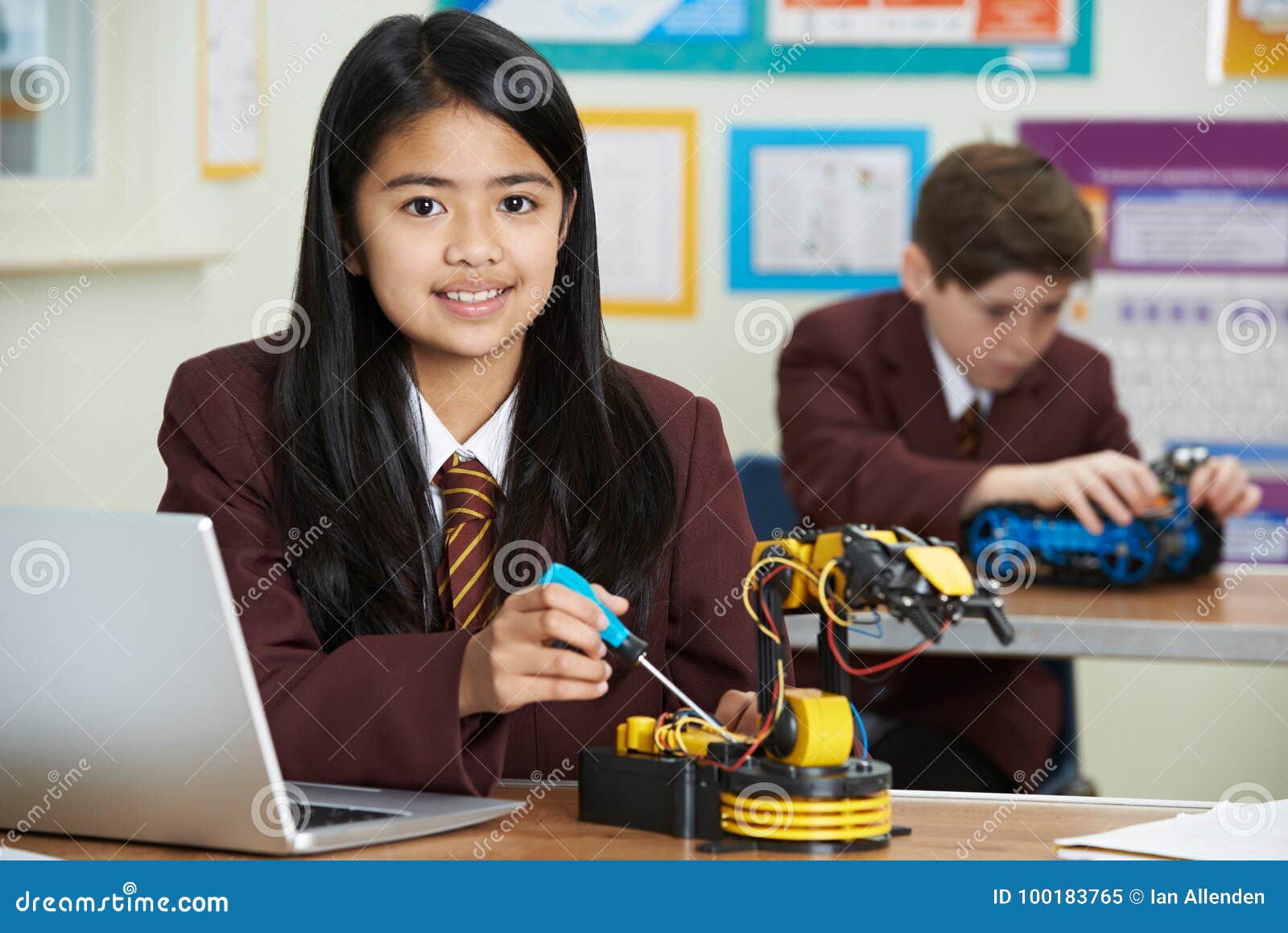 Portrait of Female Pupil in Science Lesson Studying Robotics Stock ...