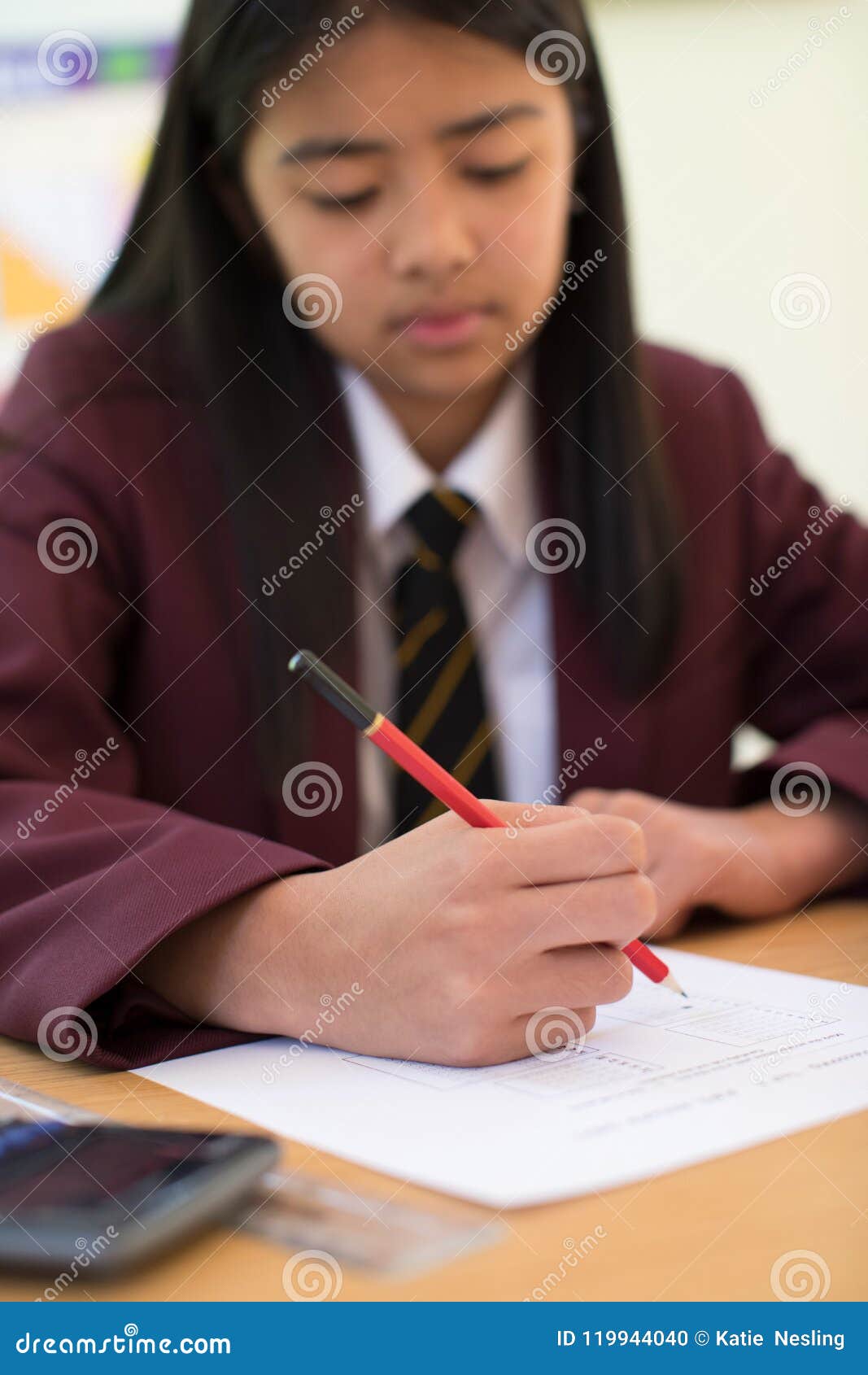Female Pupil in Uniform Taking Multiple Choice Examination Paper Stock ... Female Pupil in Uniform Taking Multiple Choice Examination Paper Stock ...