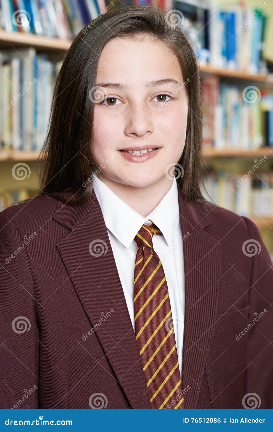Female Pupil Wearing School Uniform Standing in Library Stock Photo ...