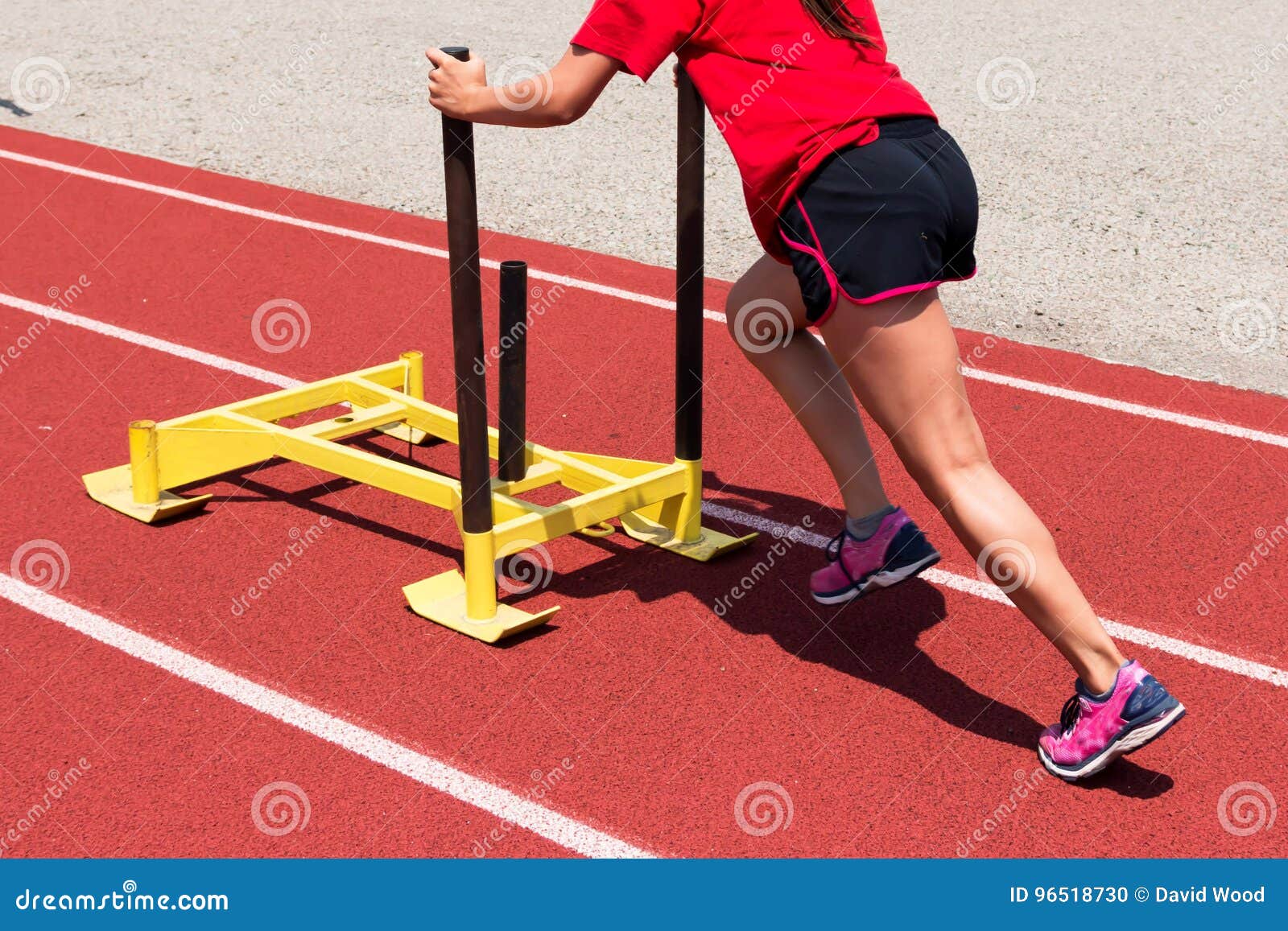 Female Pushes a Yellow Sled on a Track at Practice Stock Photo - Image ...