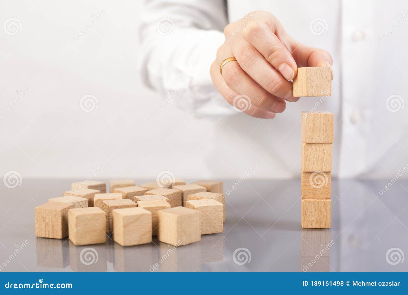 Female Putting Blocks on Top of Each Other Stock Photo - Image of ...