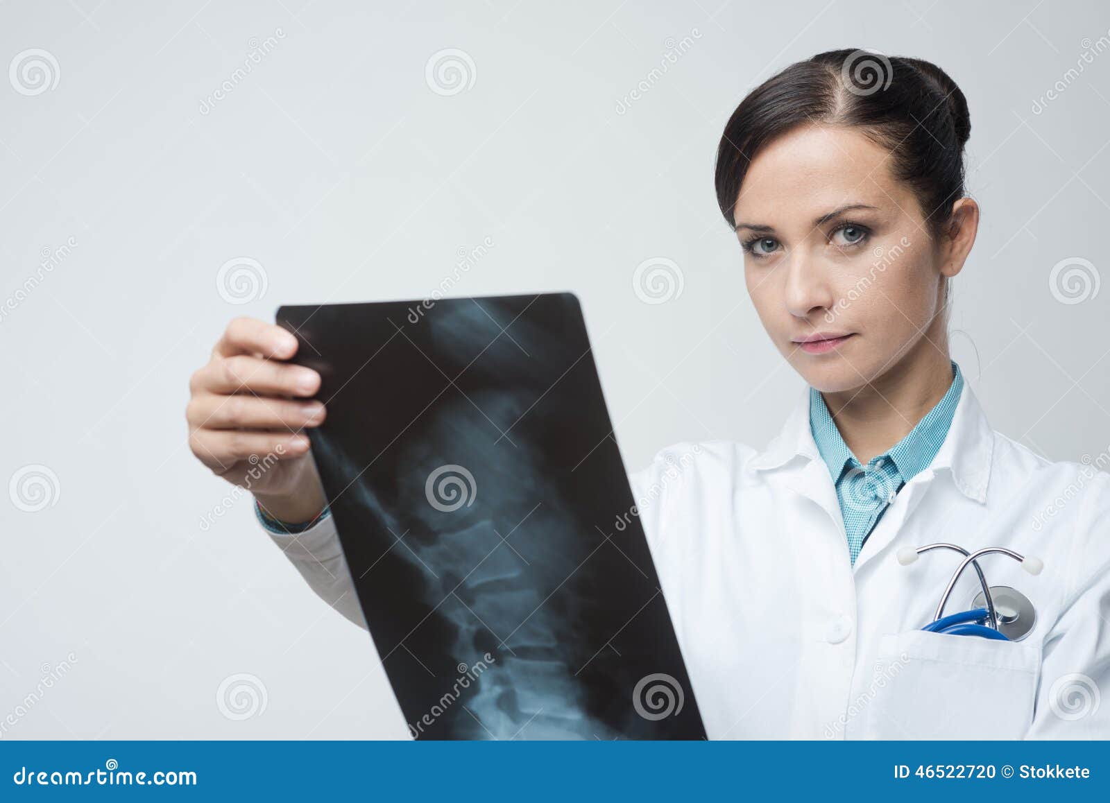 Female Radiologist Checking X-ray Image Stock Photo - Image of exam ...