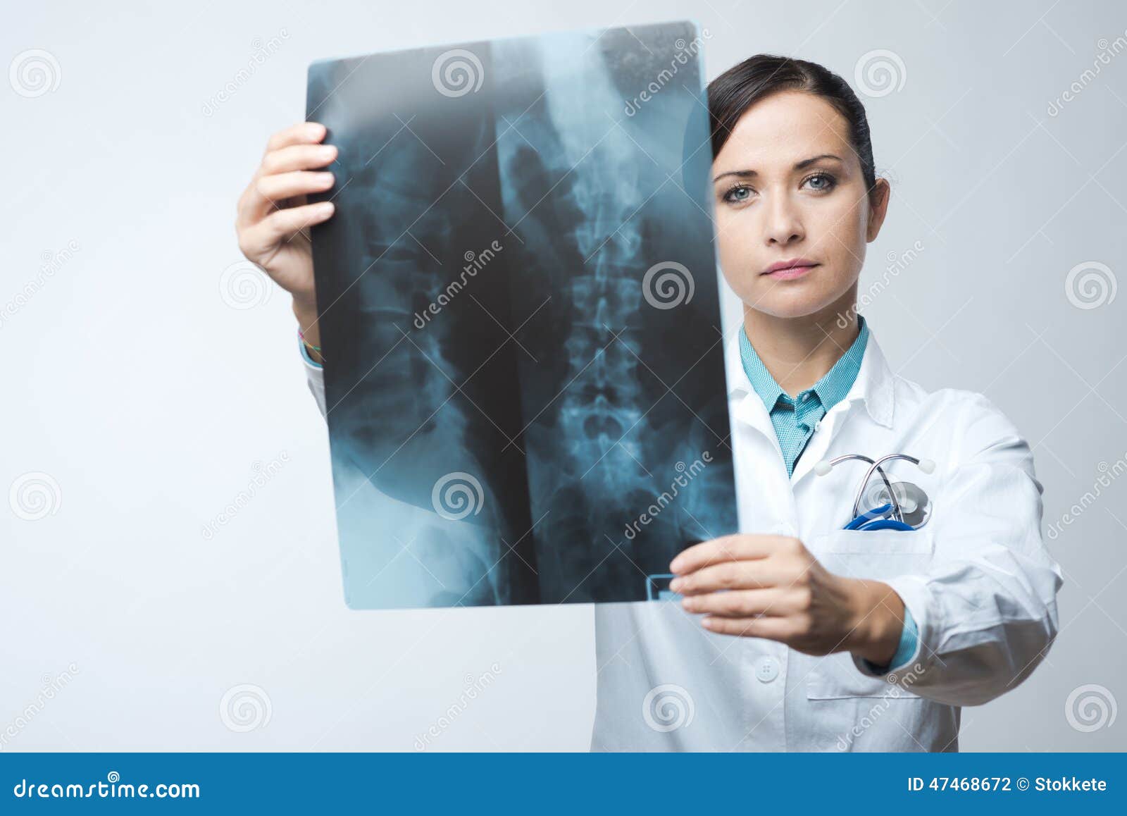 Female Radiologist Checking X-ray Image Stock Photo - Image of medical ...
