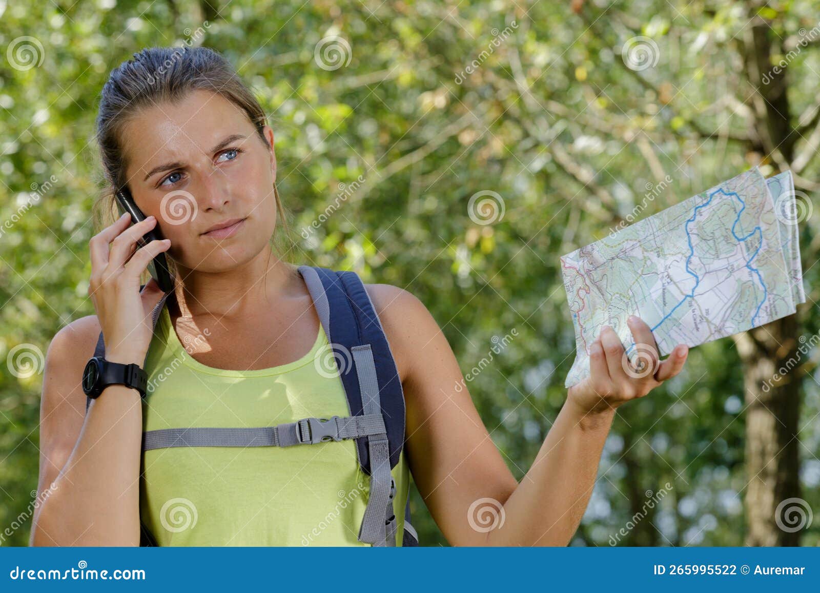 Female Rambler Holding Map and Talking on Smartphone Stock Photo ...