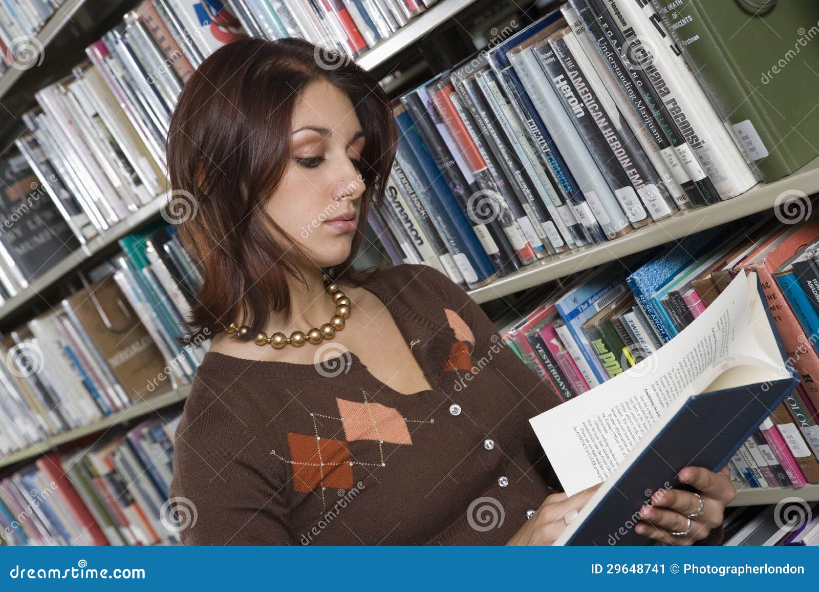 Female Reading a Book in Library Stock Image - Image of books, leisure ...