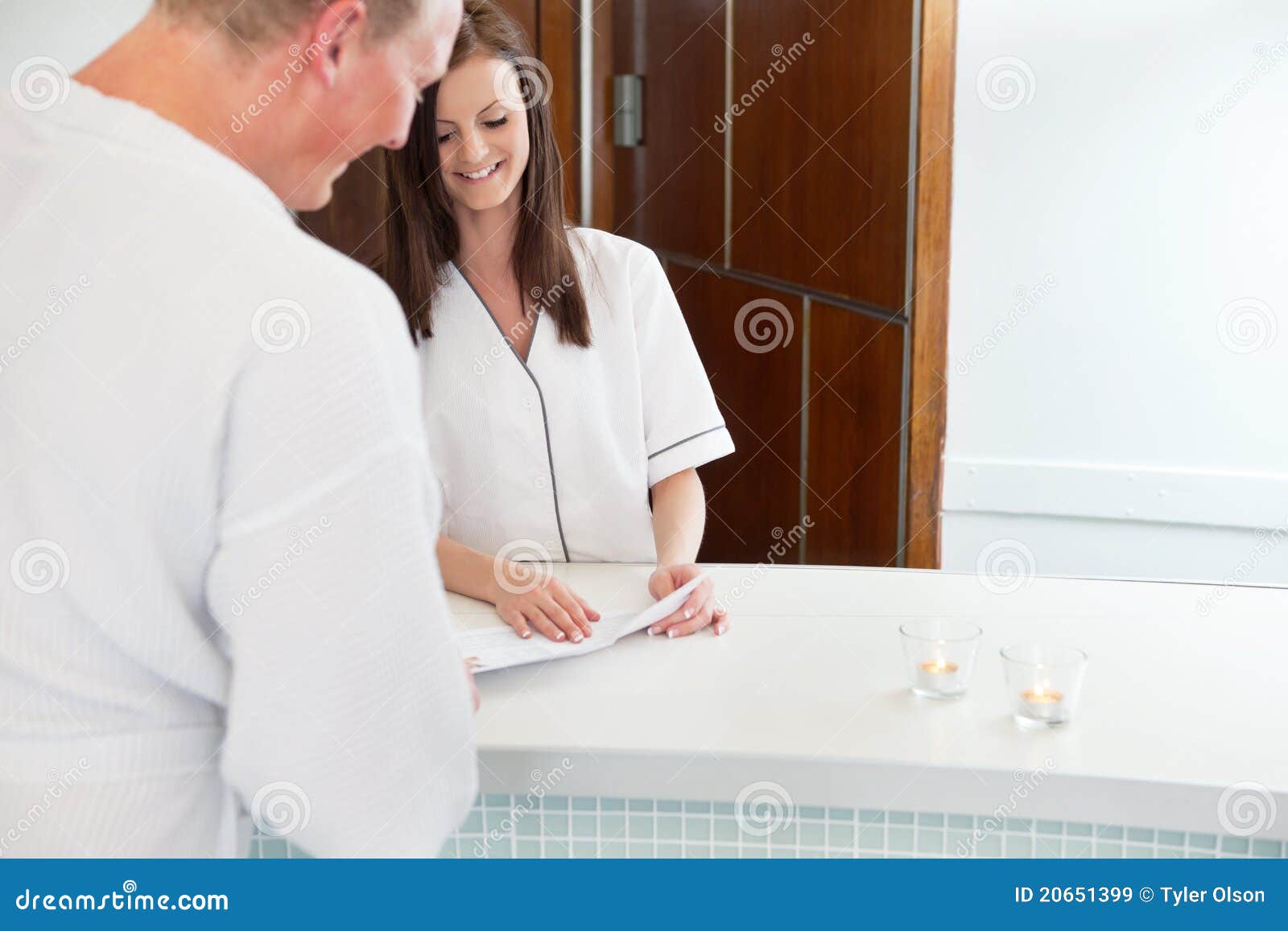 Female Receptionist and Male Customer at Spa Stock Image - Image of ...