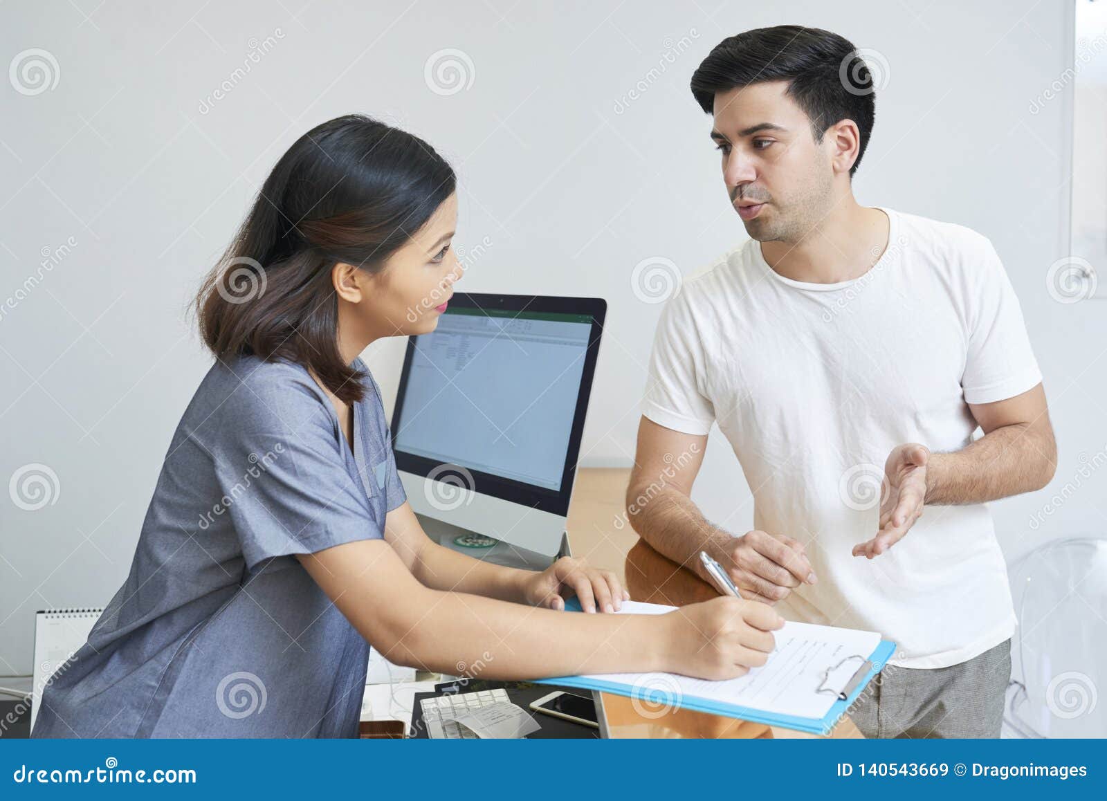 Receptionist Working with Client Stock Image - Image of receptionist ...