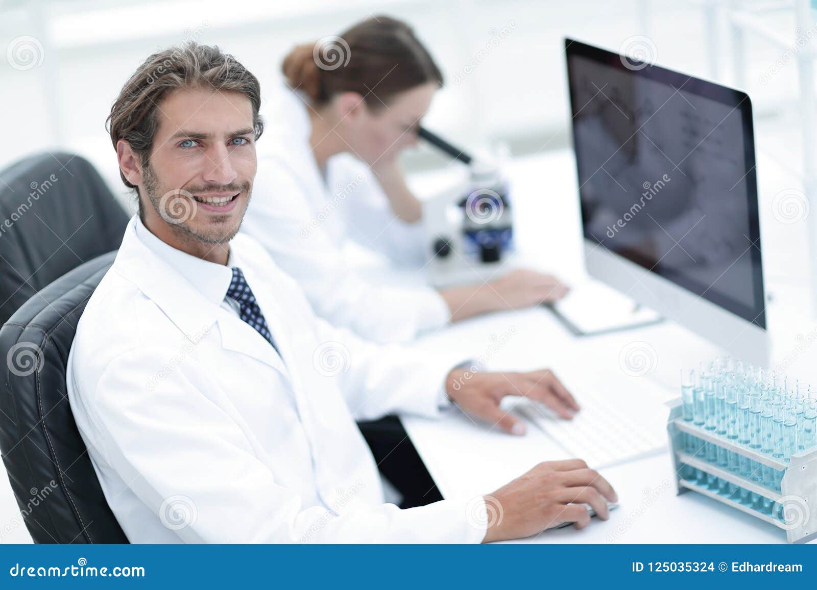 Young Male Technician Working on Computer in Laboratory Stock Photo ...