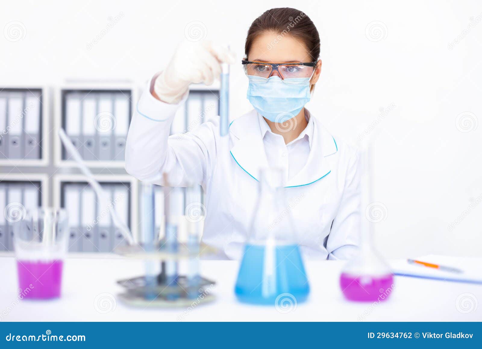 Female Researcher Observing Liquid in Flask Stock Photo - Image of ...