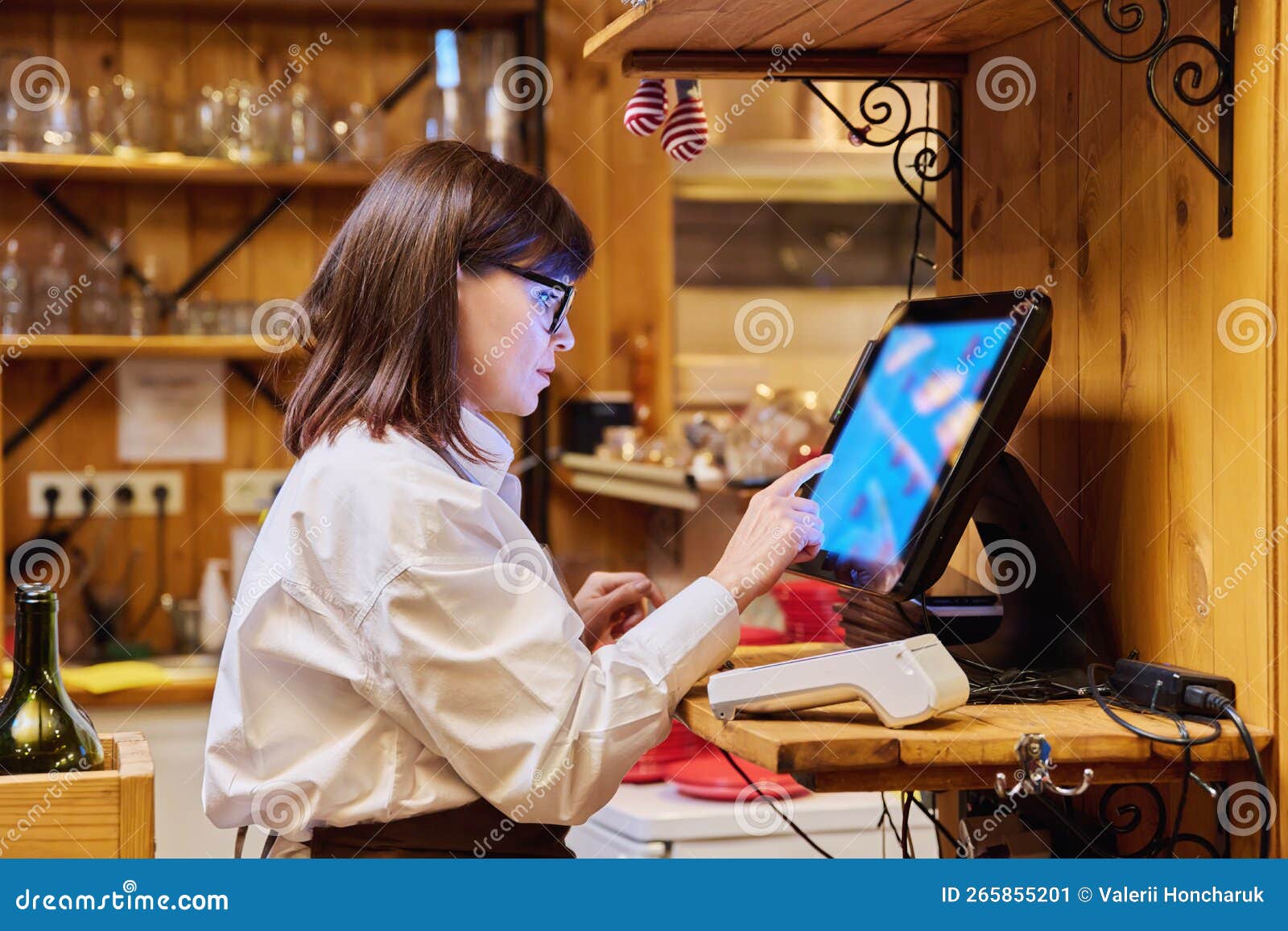 Female Restaurant Worker Using Computer Terminal while Serving ...
