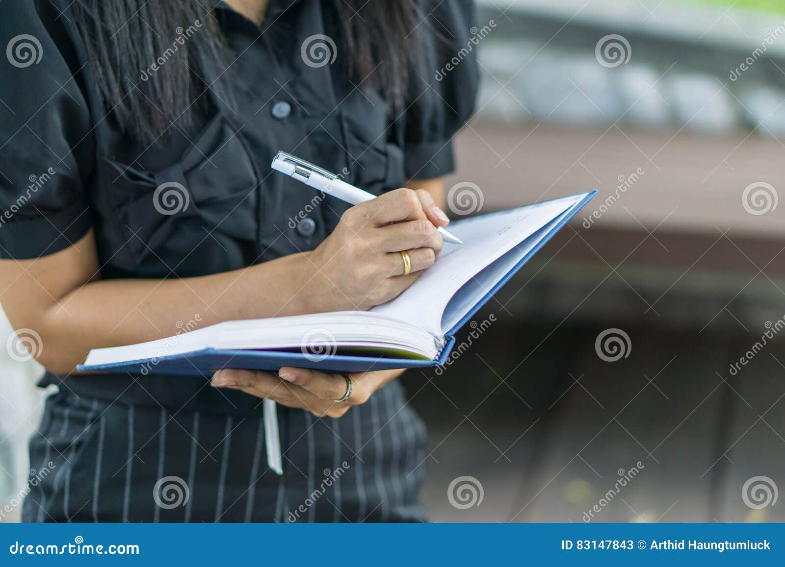 Female Right Hands with Pen Writing on Notebook on Grass Outside Stock ...
