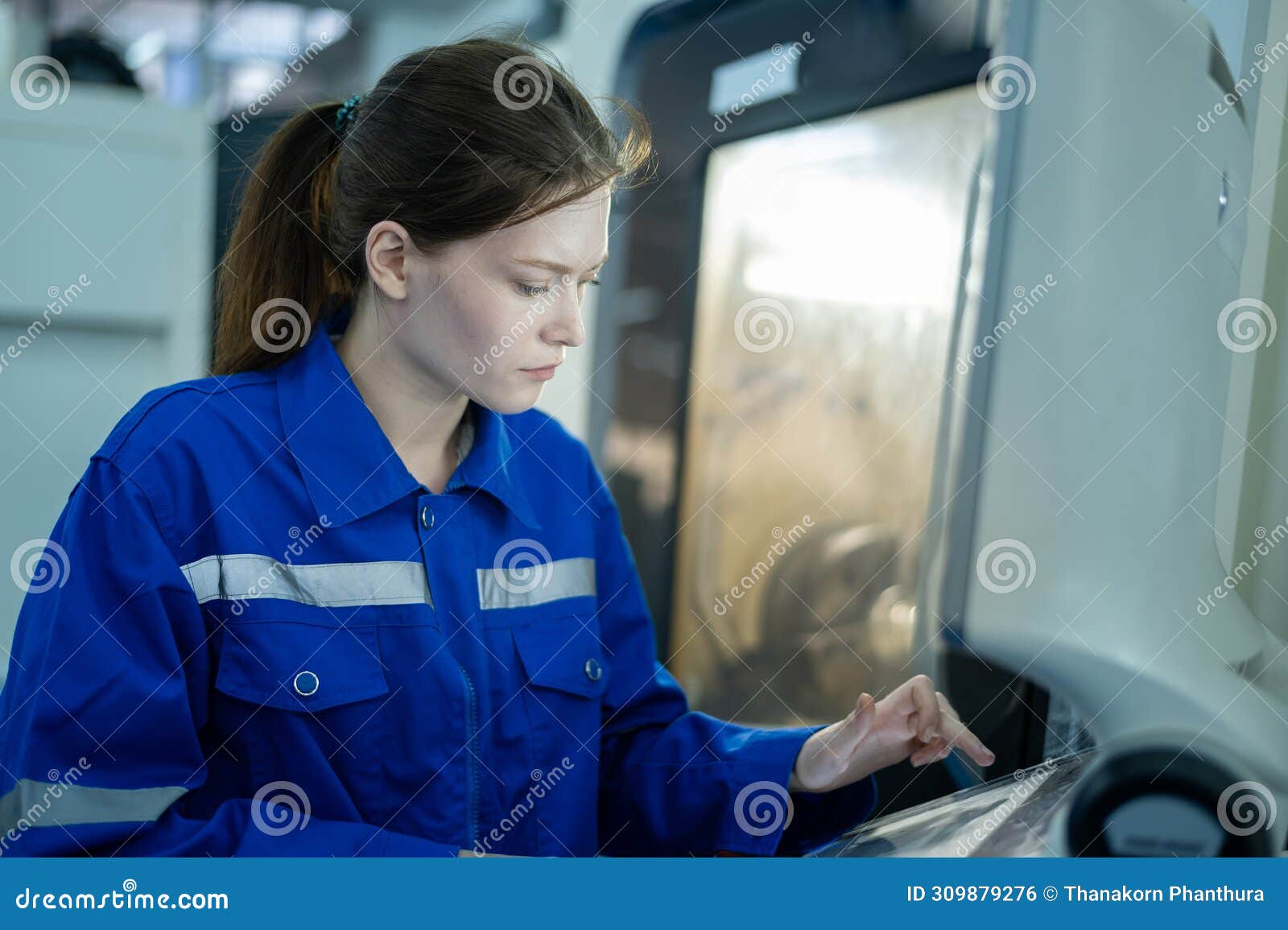 Female Robotics Engineers Using Controller To Remotely Operate Programming And Manipulating