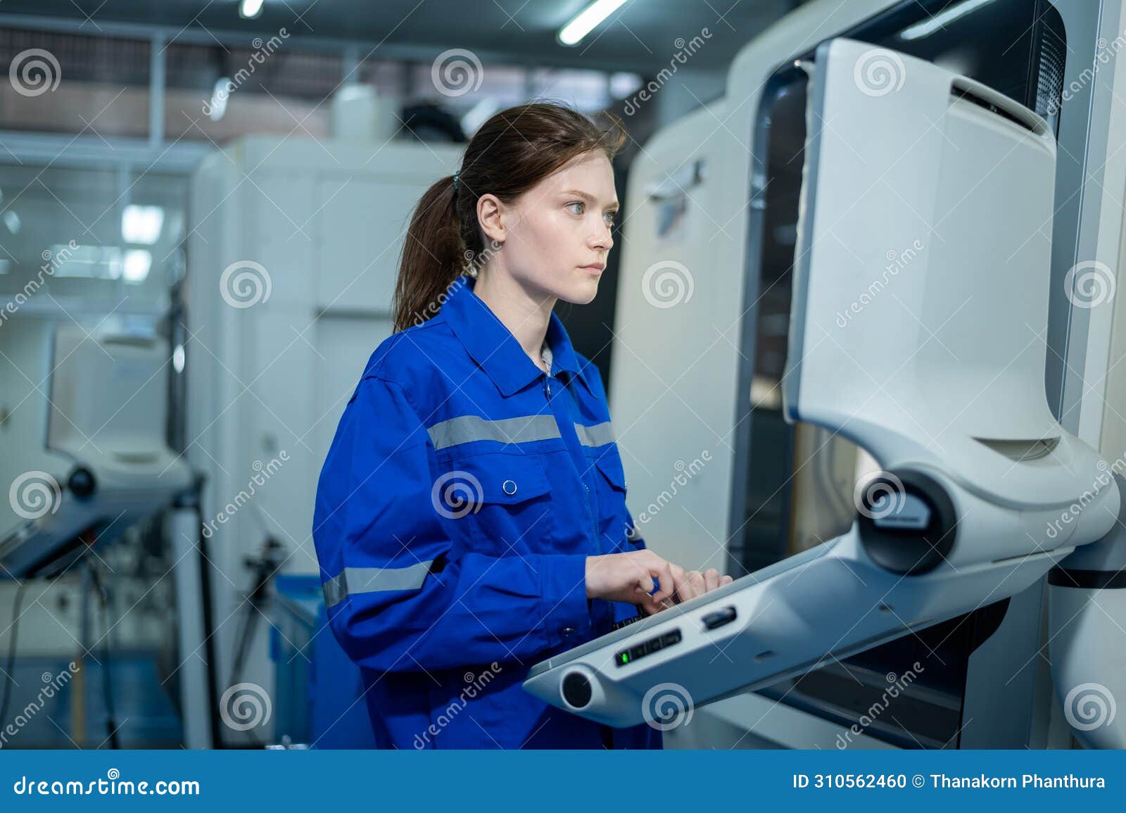 Female Robotics Engineers Using Controller To Remotely Operate Programming and Manipulating ...