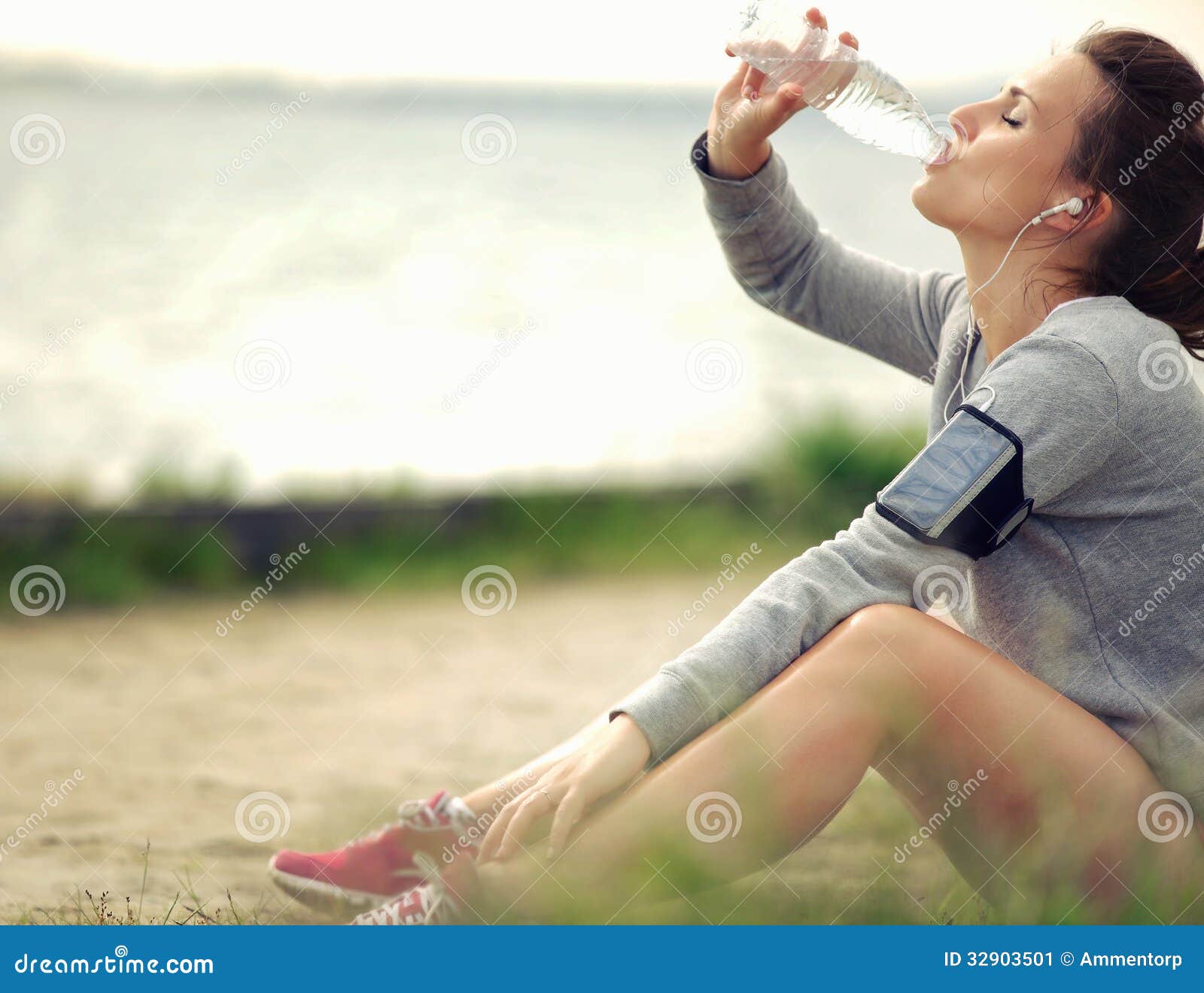 Female Runner Drinking Water Stock Image - Image of bottle, holding ...