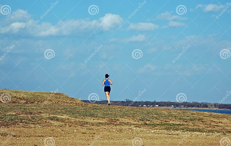Female Runner at the Lake stock image. Image of lakeside - 516517