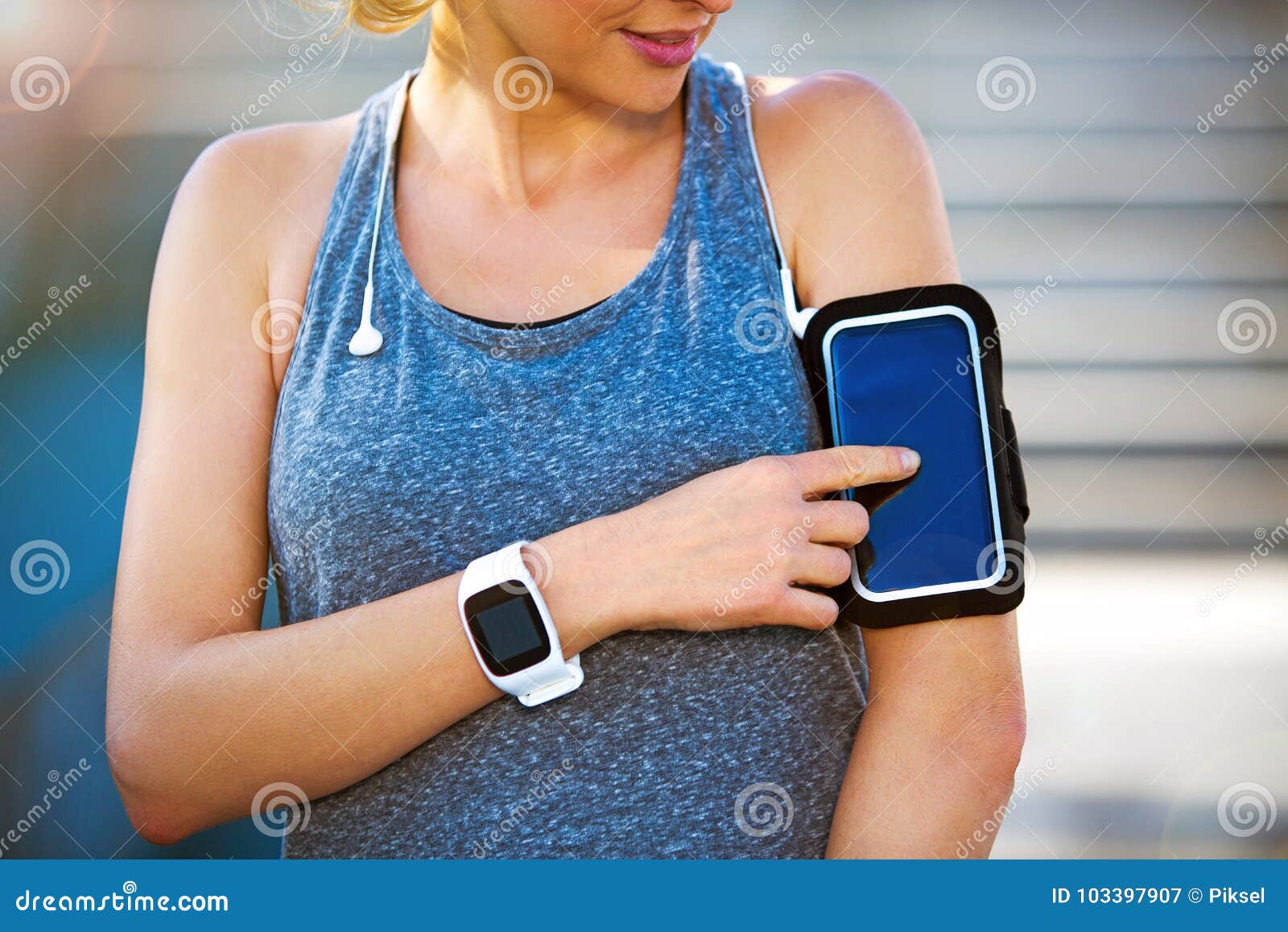Female Runner with Mobile Phone and Smart Watch Stock Image - Image of ...