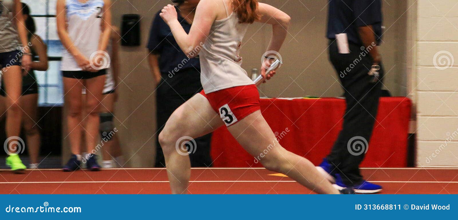 Female Runner Running Fast on an Indoor Track Stock Image - Image of ...