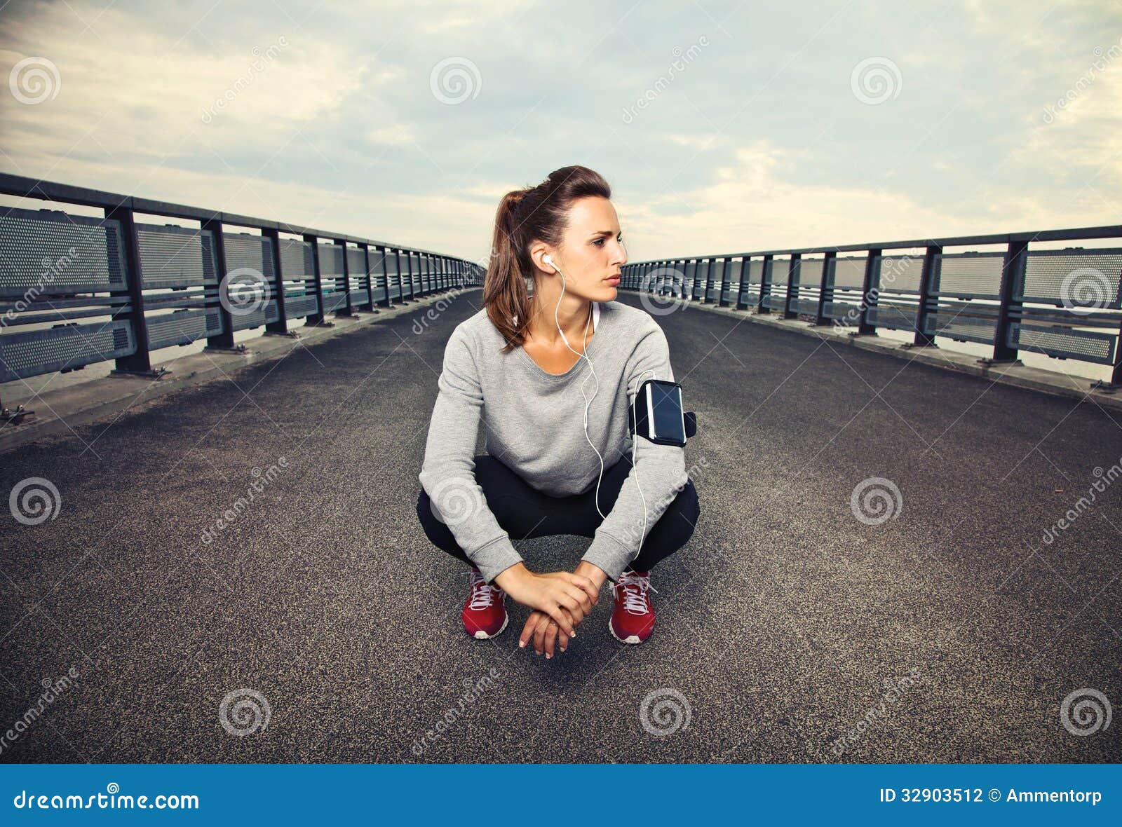 Female Runner Sitting stock photo. Image of girl, listening - 32903512