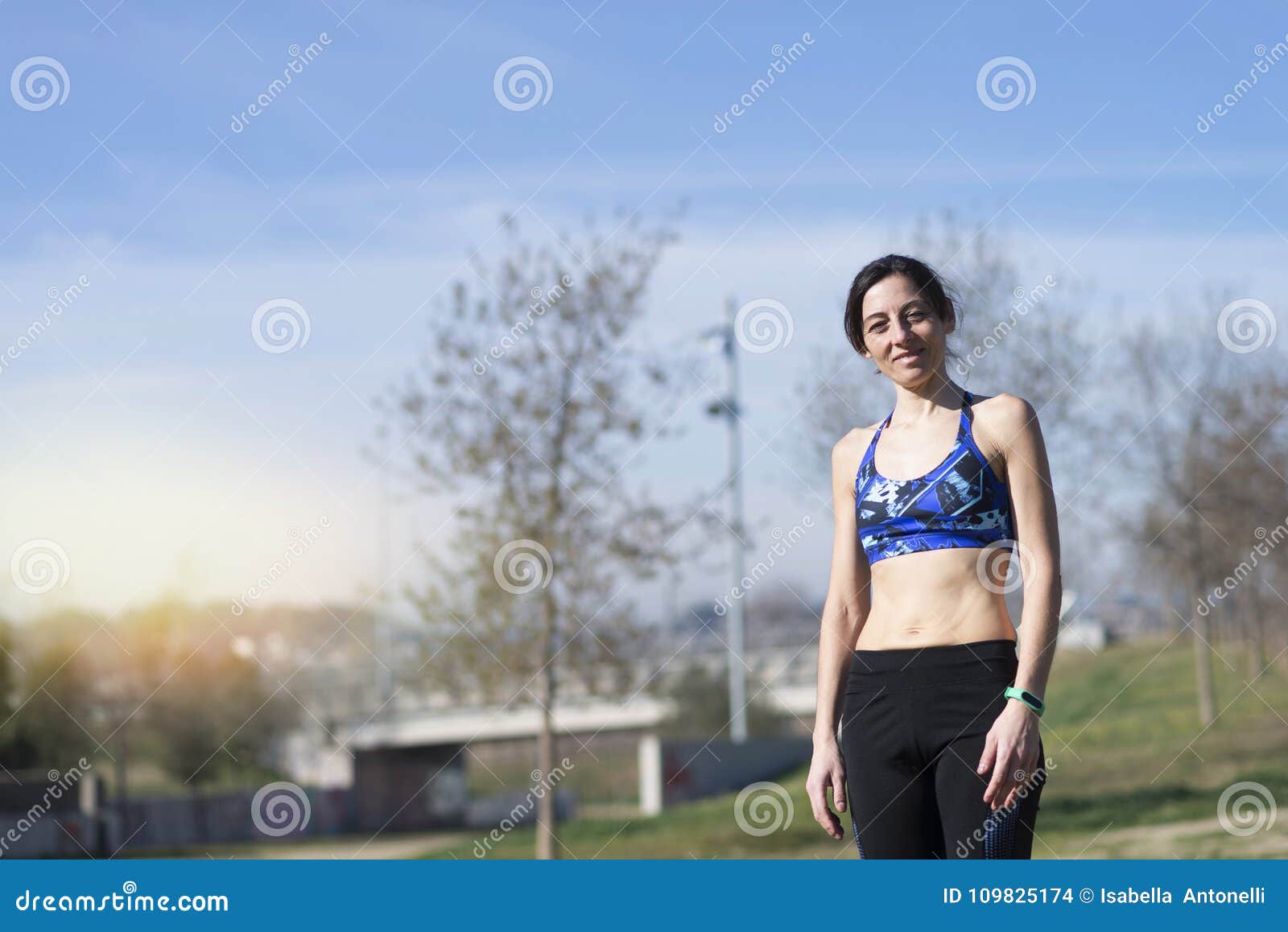 Portrait of a Female Runner Smiling before Jogging at the Park Stock ...
