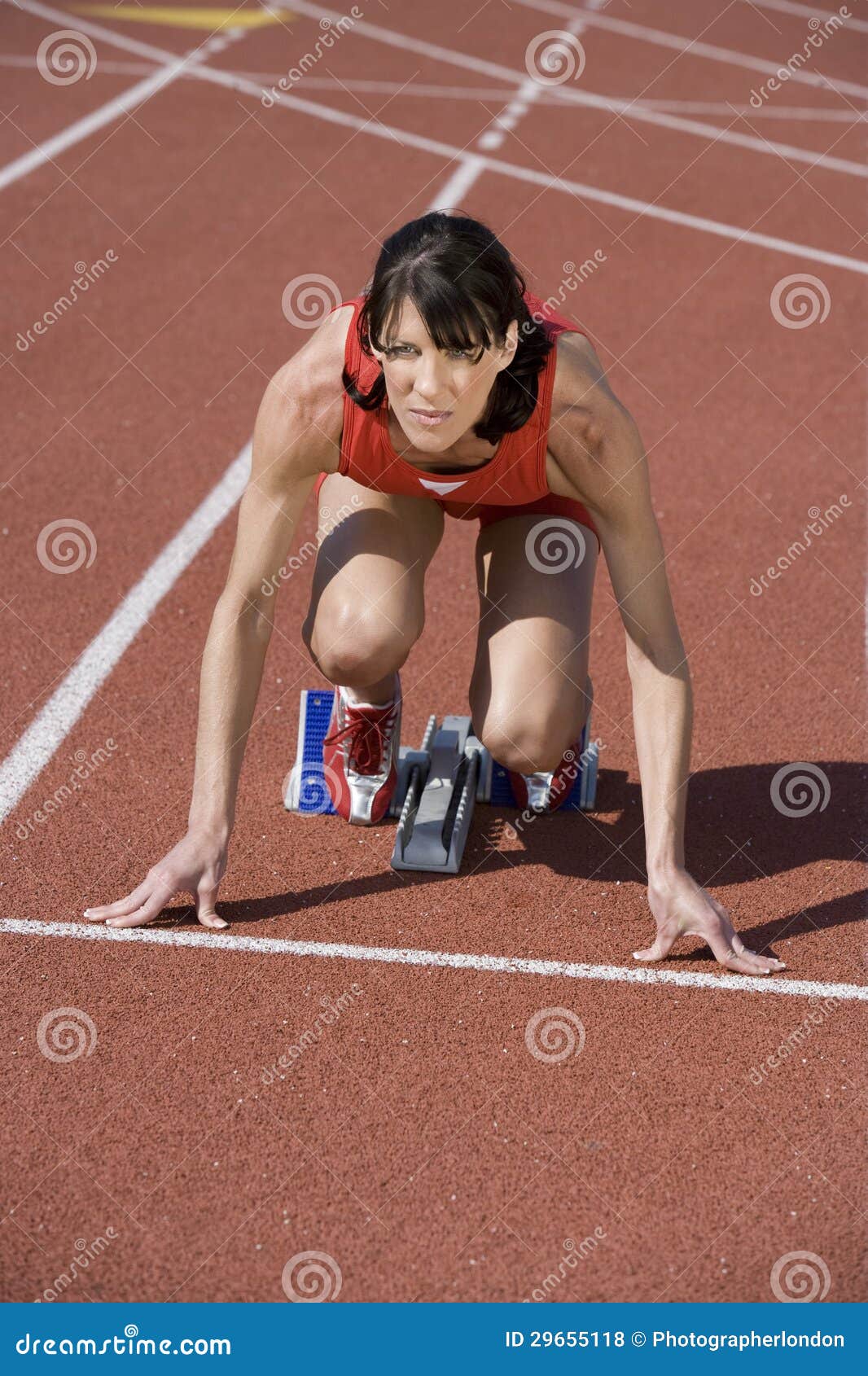 Female Runner at Starting Line Stock Photo - Image of people, racetrack ...