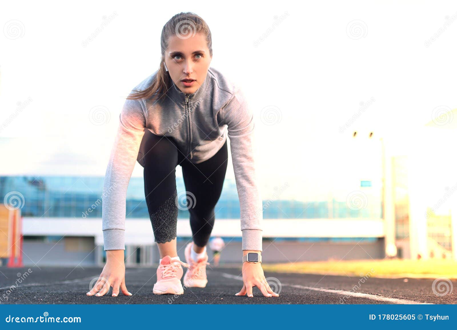 Female Runner Waiting for the Start on the Start Line in Stadium Stock ...