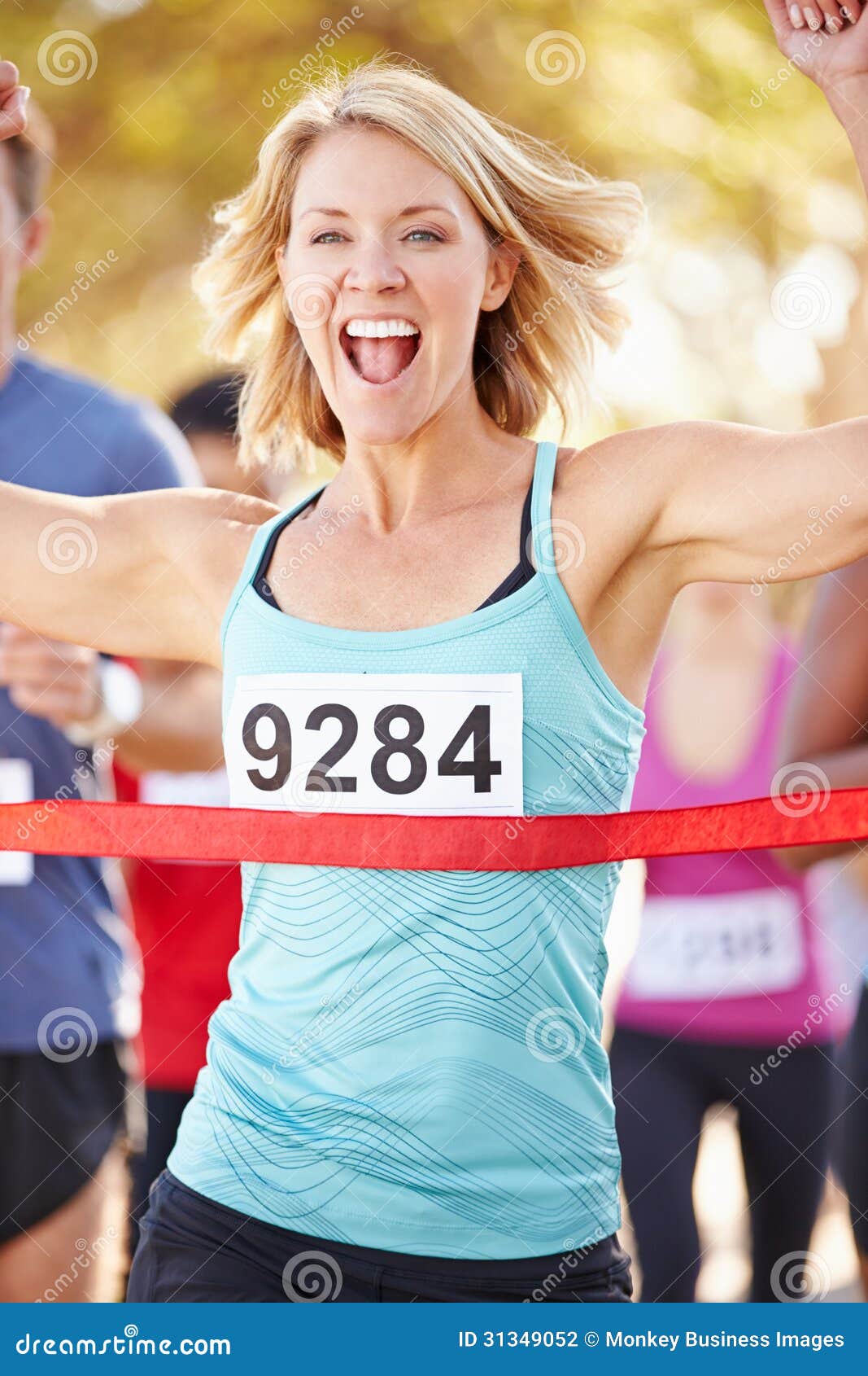 Female Runner Winning Marathon Stock Photo - Image of american ...