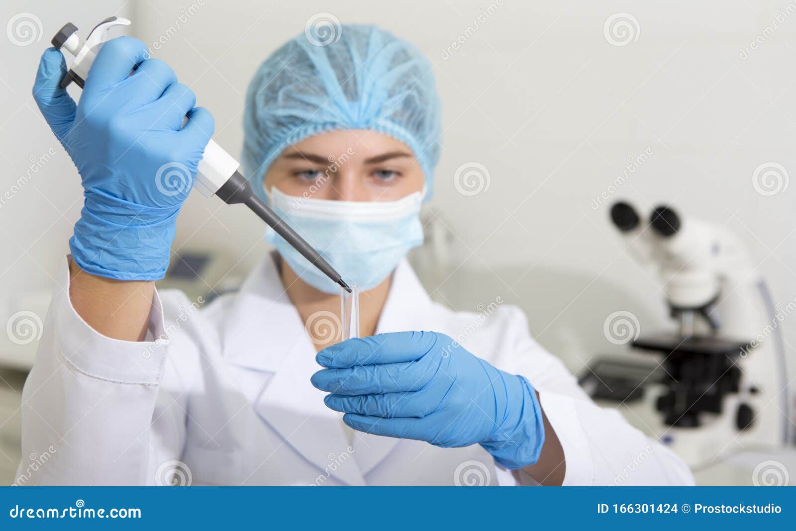 Female Scientist Dropping Samples from Big Pipette for Testing on ...